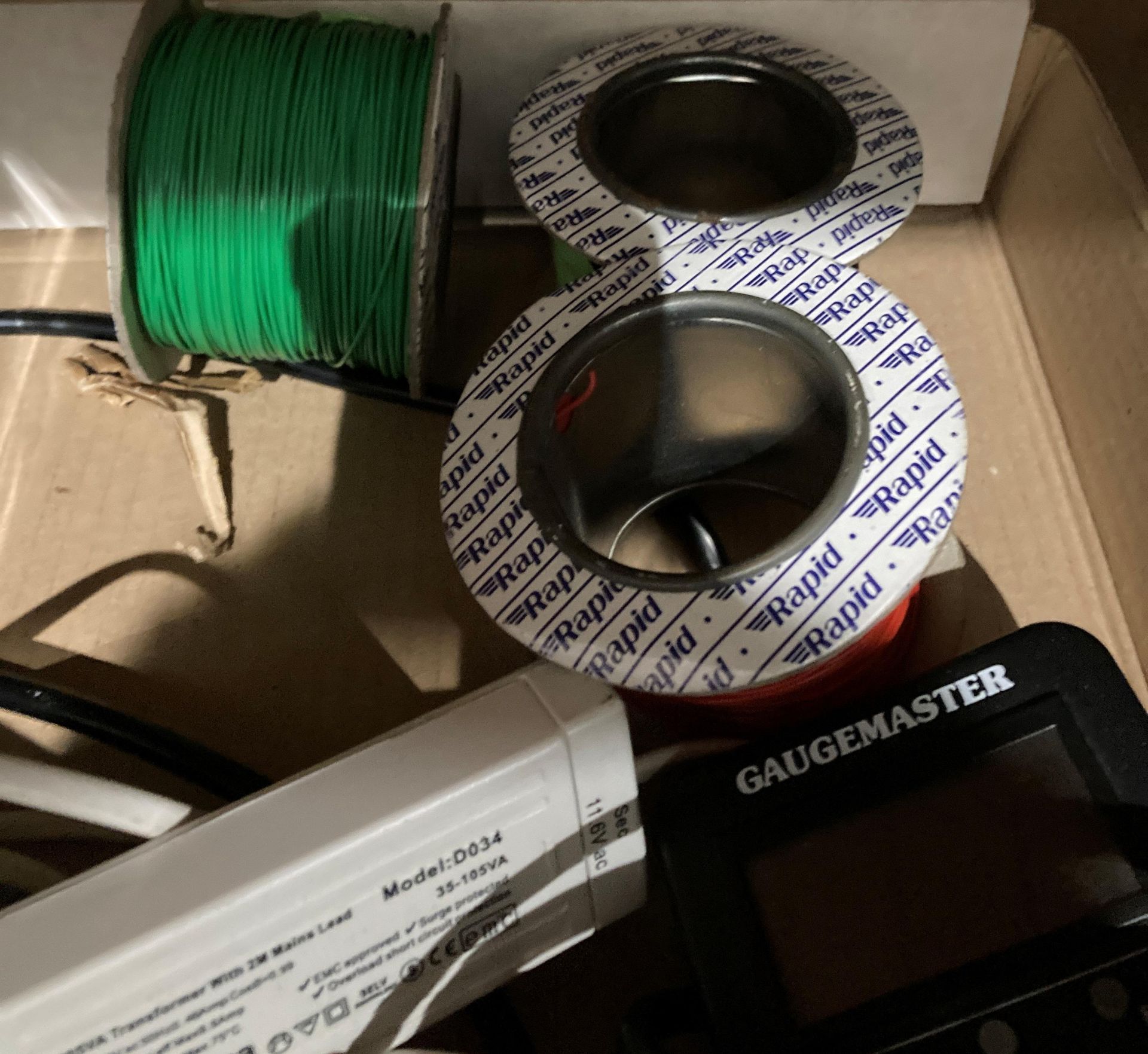 Contents to tray; a GaugeMaster Prodigy Express Walkaround controller ...