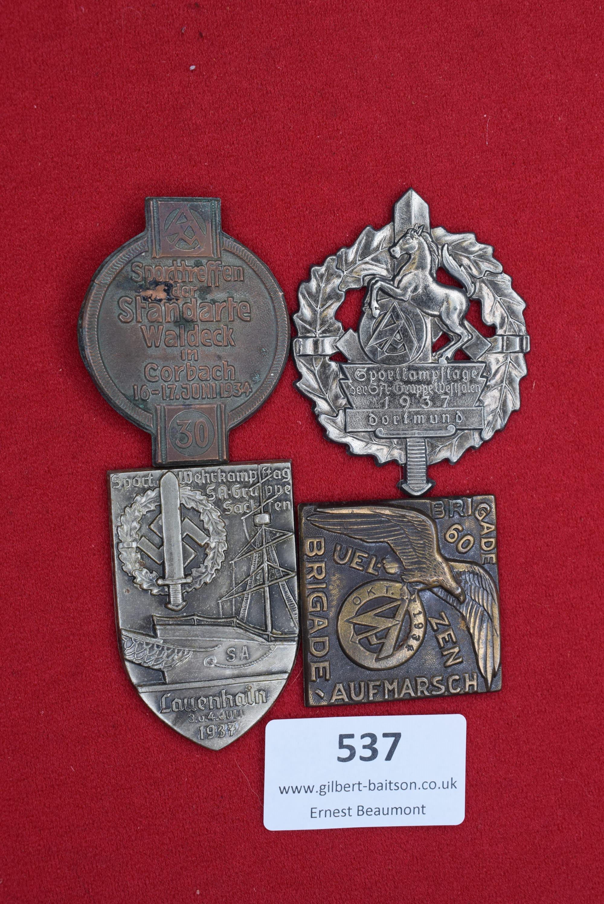 A group of four Third Reich SA badges: SA Treffen Dortmund 1932 ...