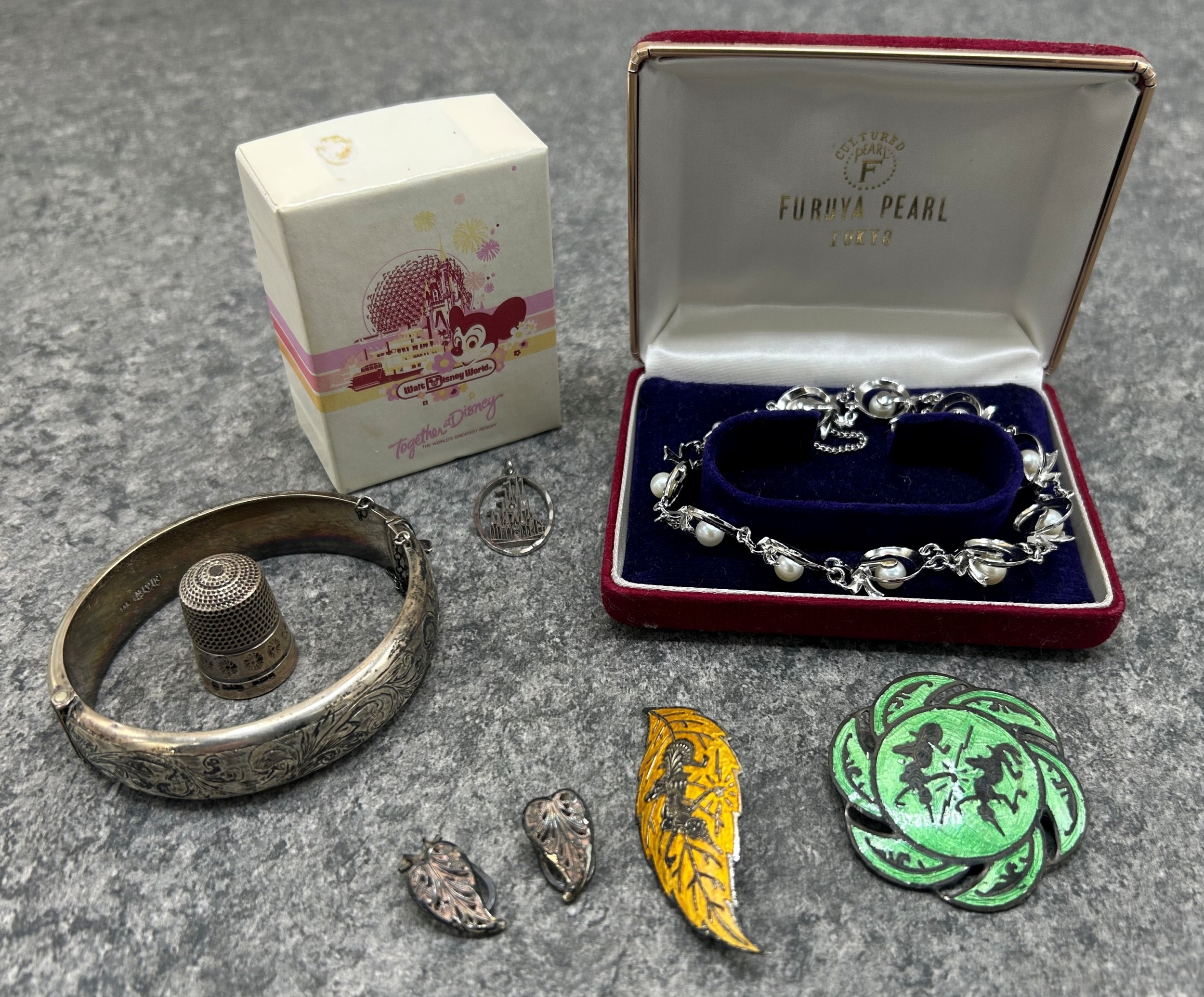 A collection of vintage silver jewellery to include a hinged bangle, a ...