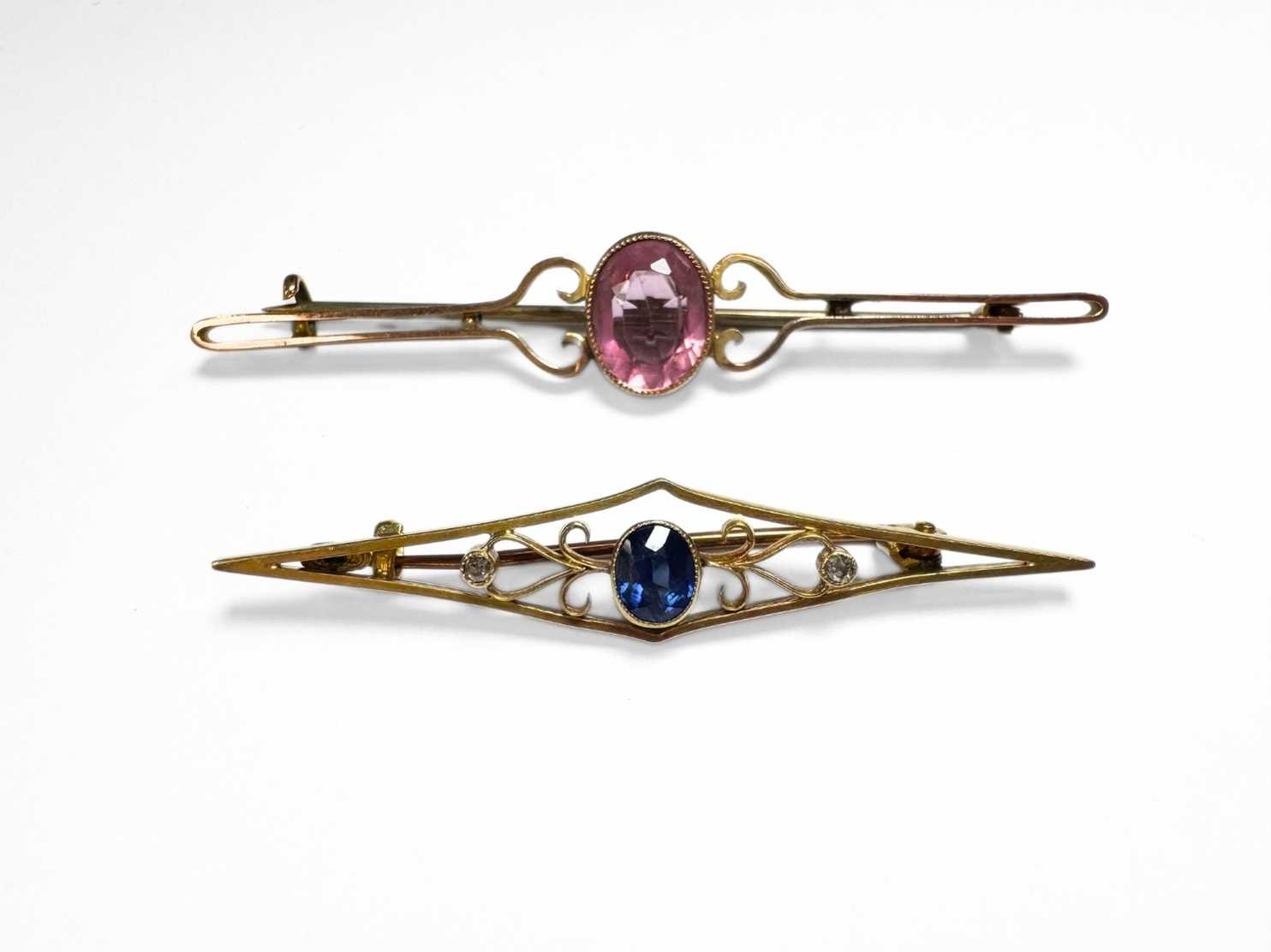 Two gold gem-set brooches, to include a pink paste brooch, stamped 9c ...