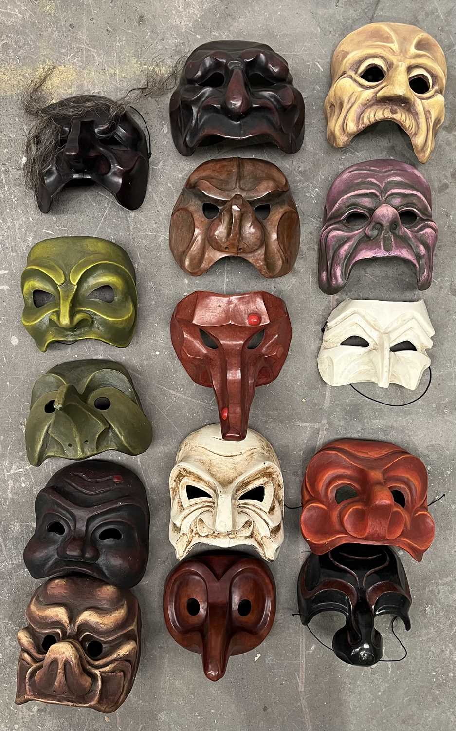 A small collection of Venetian type grotesque masks made from leather ...