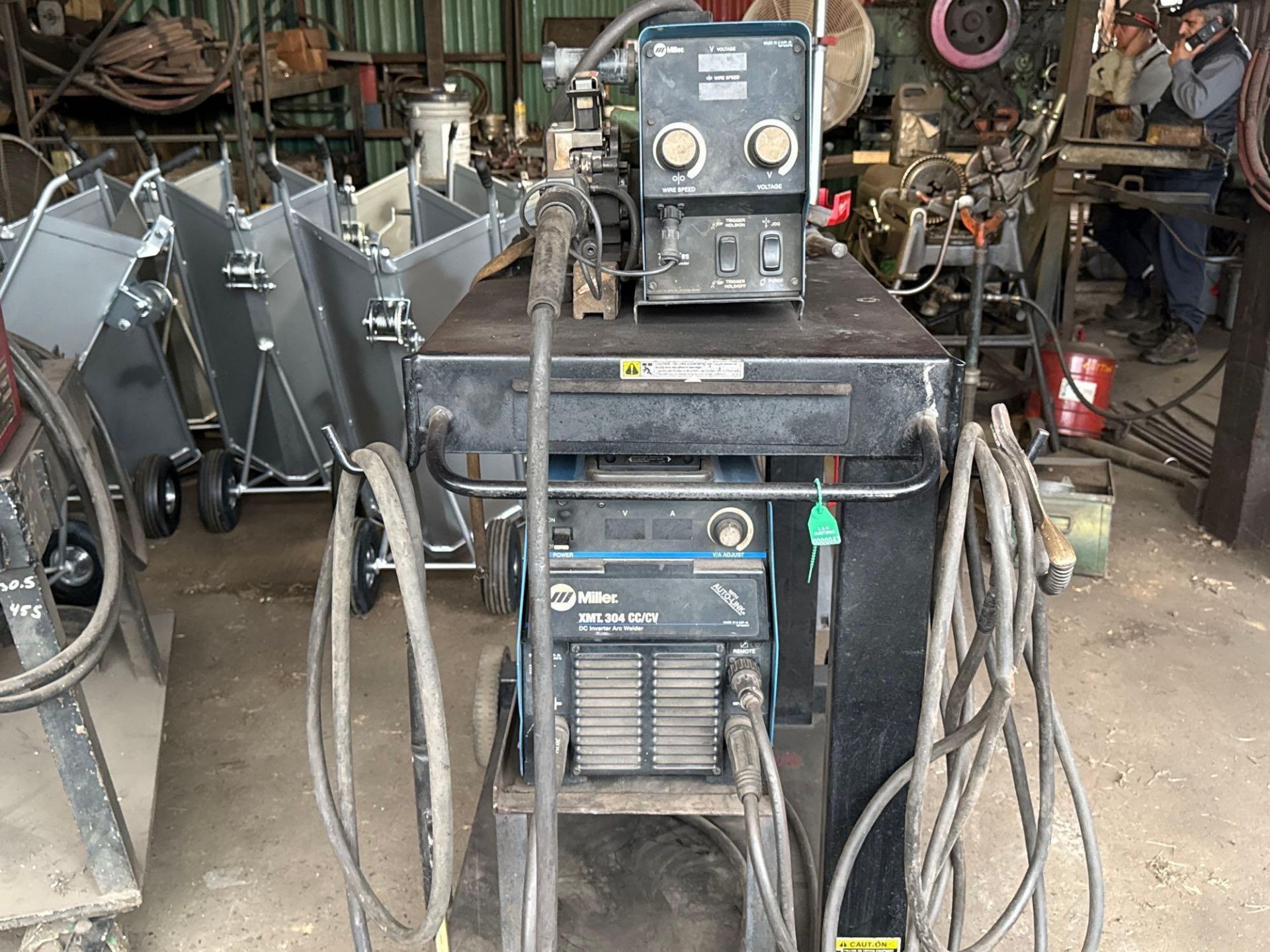 Miller xmt 304 CC \ CV welder with Miller 75 series wire feed and cart