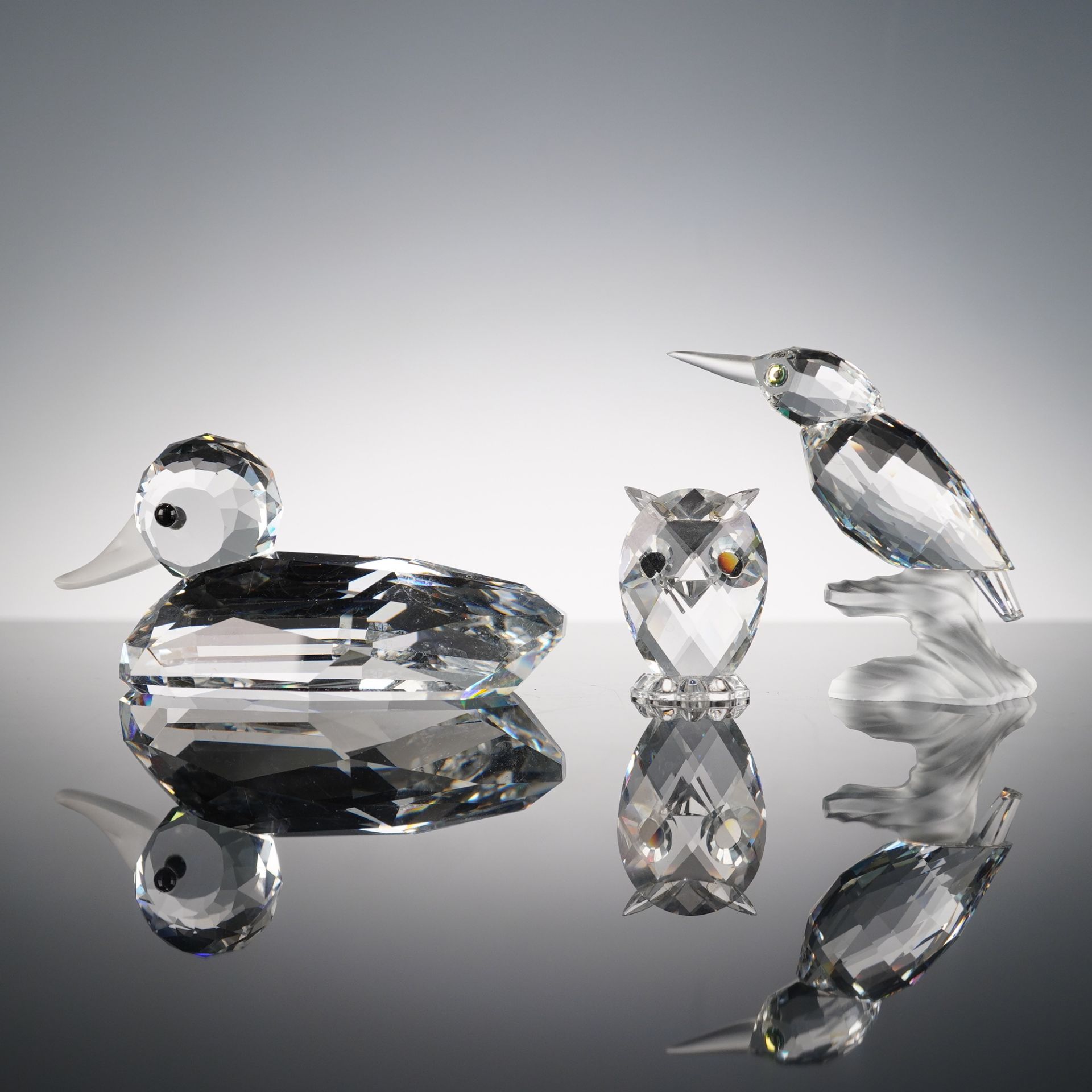 A refined collection of three Swarovski crystal bird figurines ...