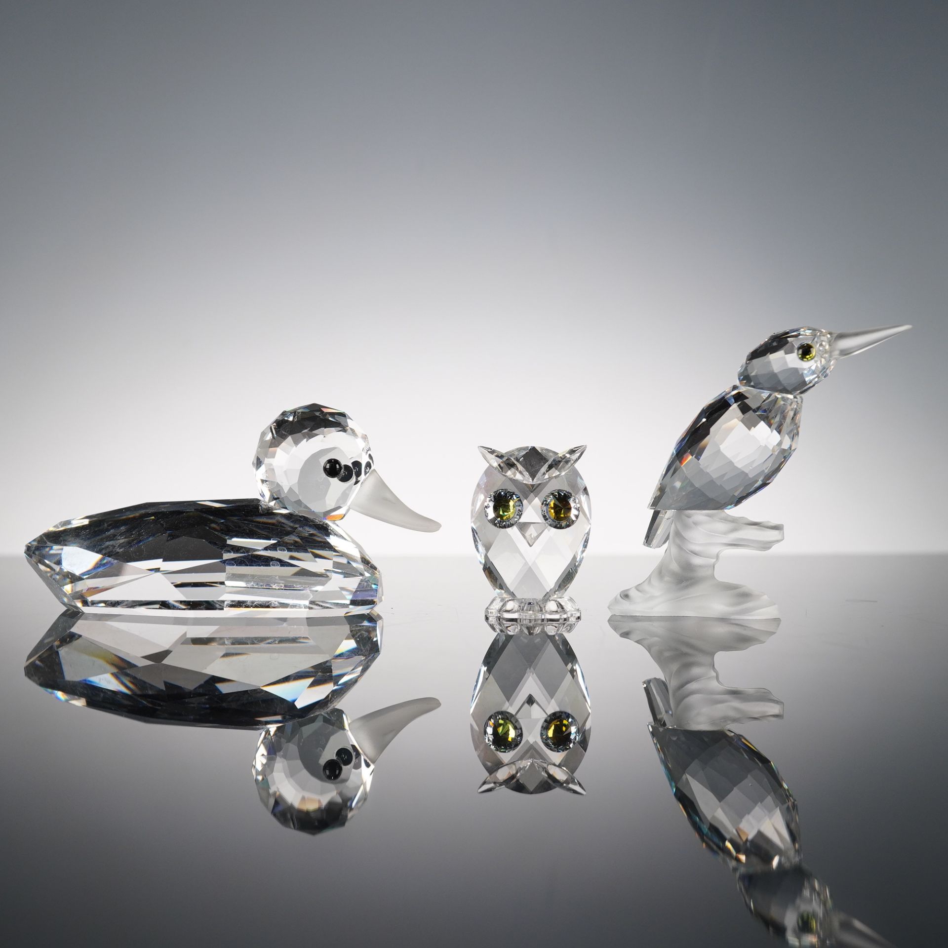 A refined collection of three Swarovski crystal bird figurines ...