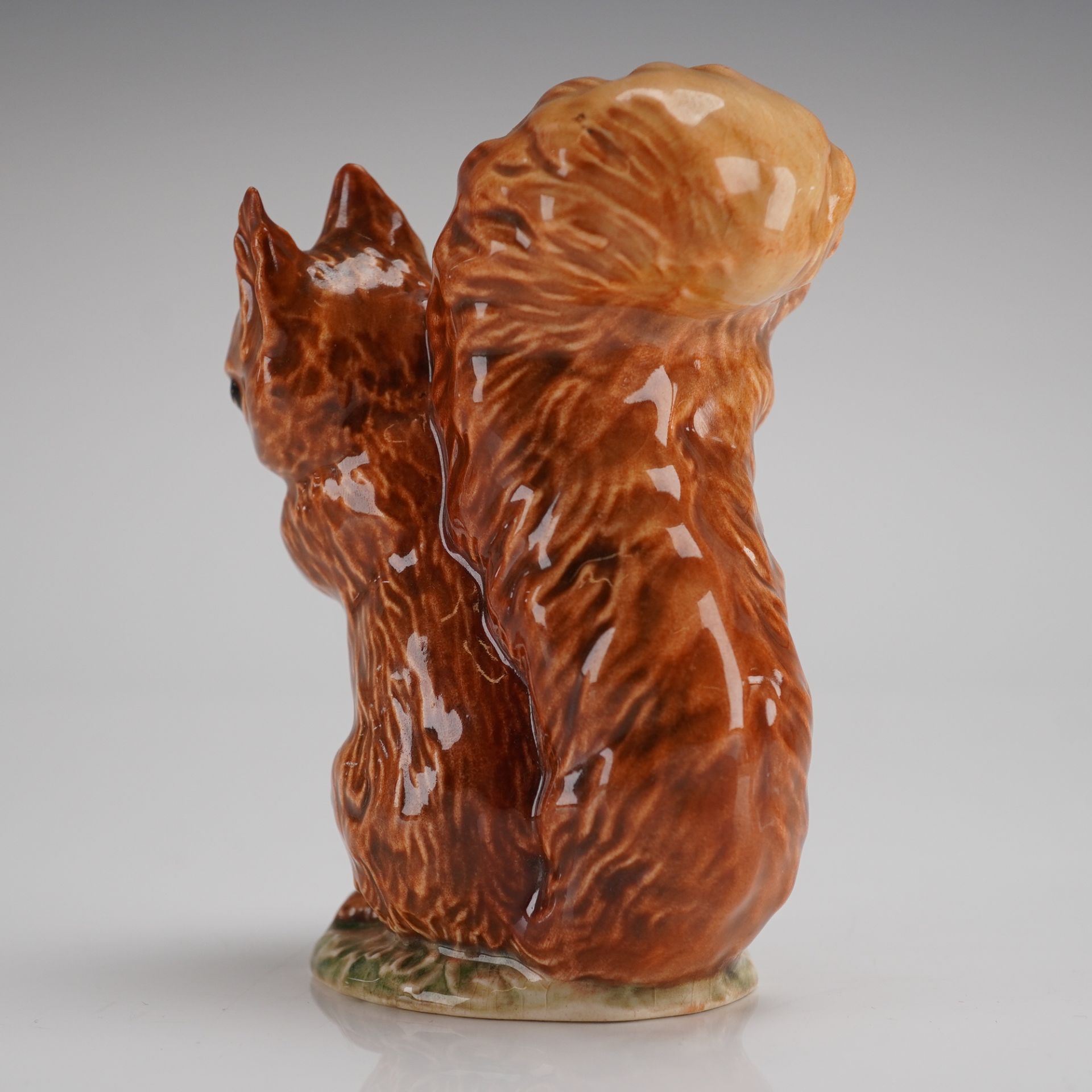 A single glazed ceramic figurine depicting the Beatrix Potter character ...