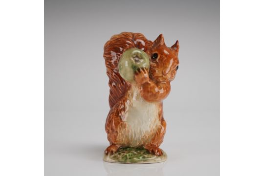 A single glazed ceramic figurine depicting the Beatrix Potter character ...