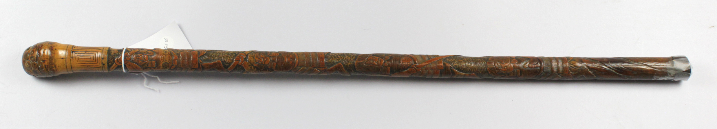 Walking stick, with Japanese stout bamboo shaft, carved with figures ...