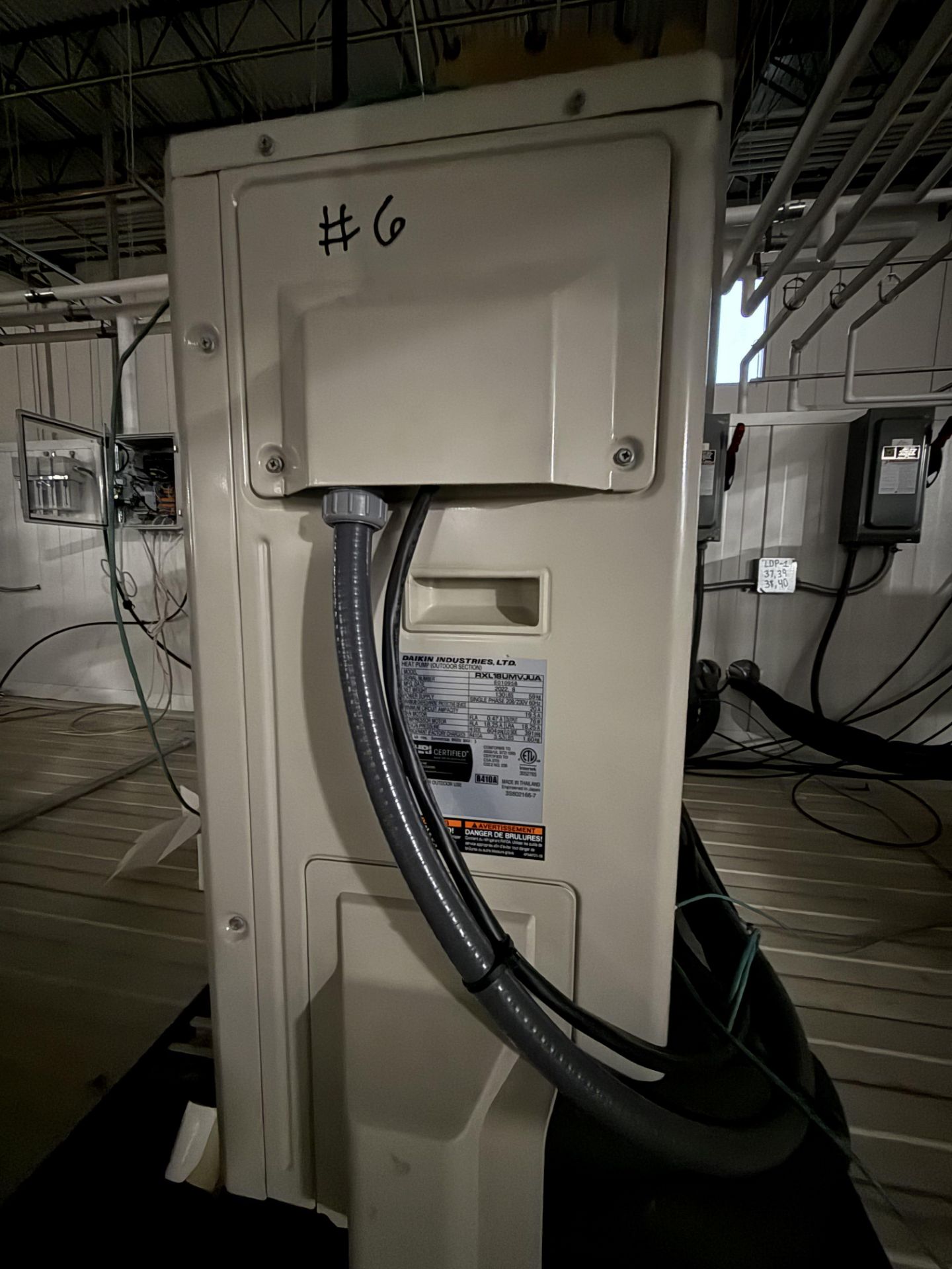 The SB6041 lot features a Daikin RXL09UMVJUA outdoor heat pump system ...