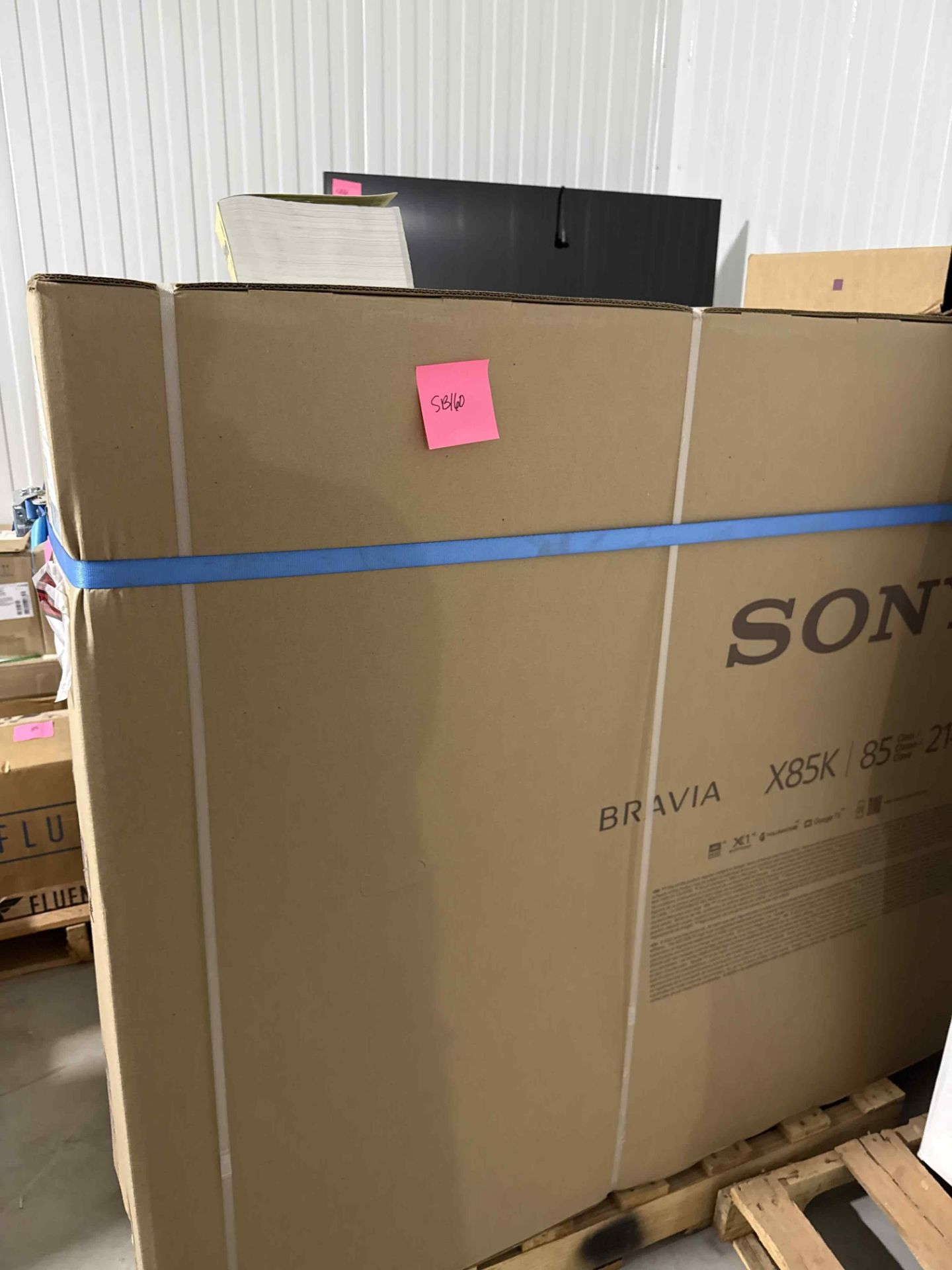 Pallet containing multiple Sony Bravia X85K 85-inch televisions in ...