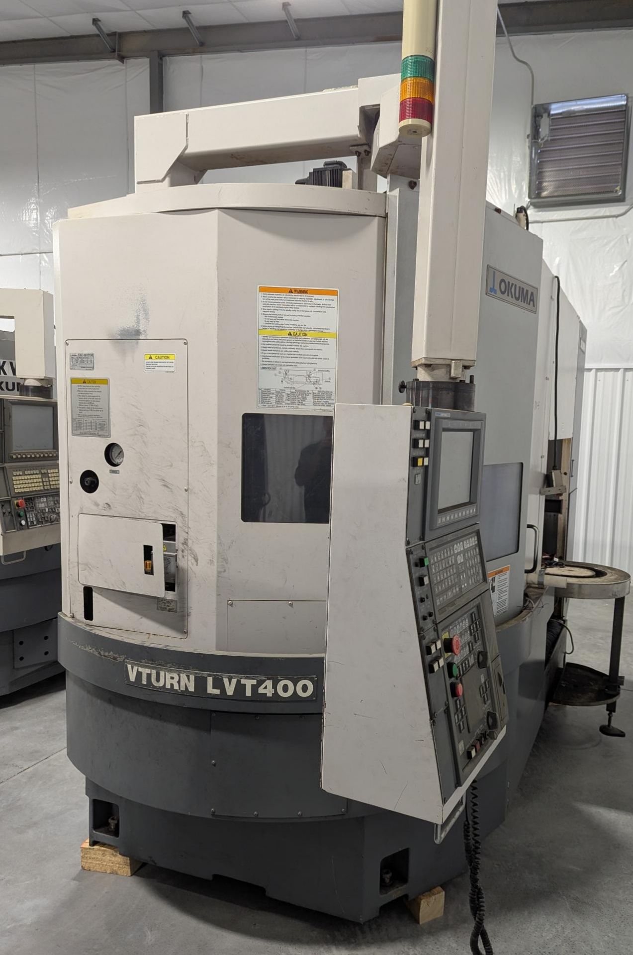 Okuma LVT 400 Vertical Turret Lathe (2005) Description Chuck size 12 ...