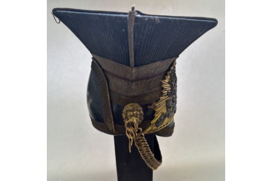 A VICTORIAN CHAPKA OF THE 16TH LANCERS with black leather skull and ...