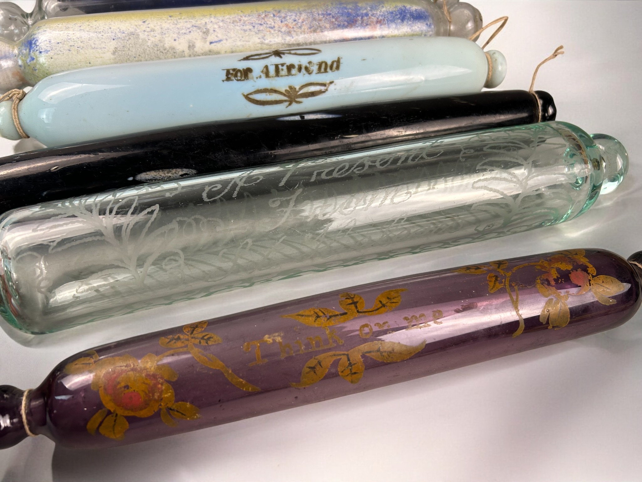 A collection of eight 19th century glass rolling pins. Including ...