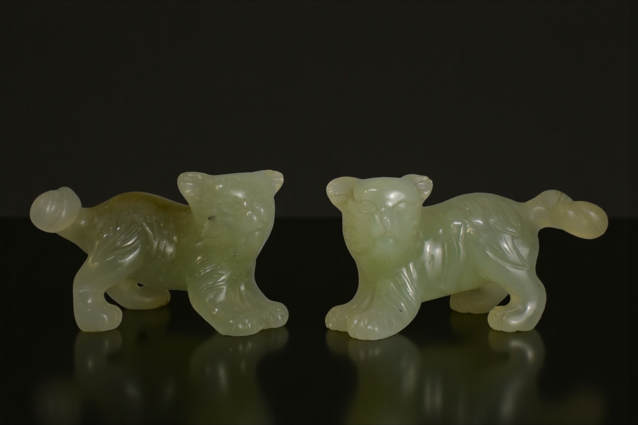 A pair of Chinese carved Jade Tiger cubs. 7.5 cm Provenance; property ...