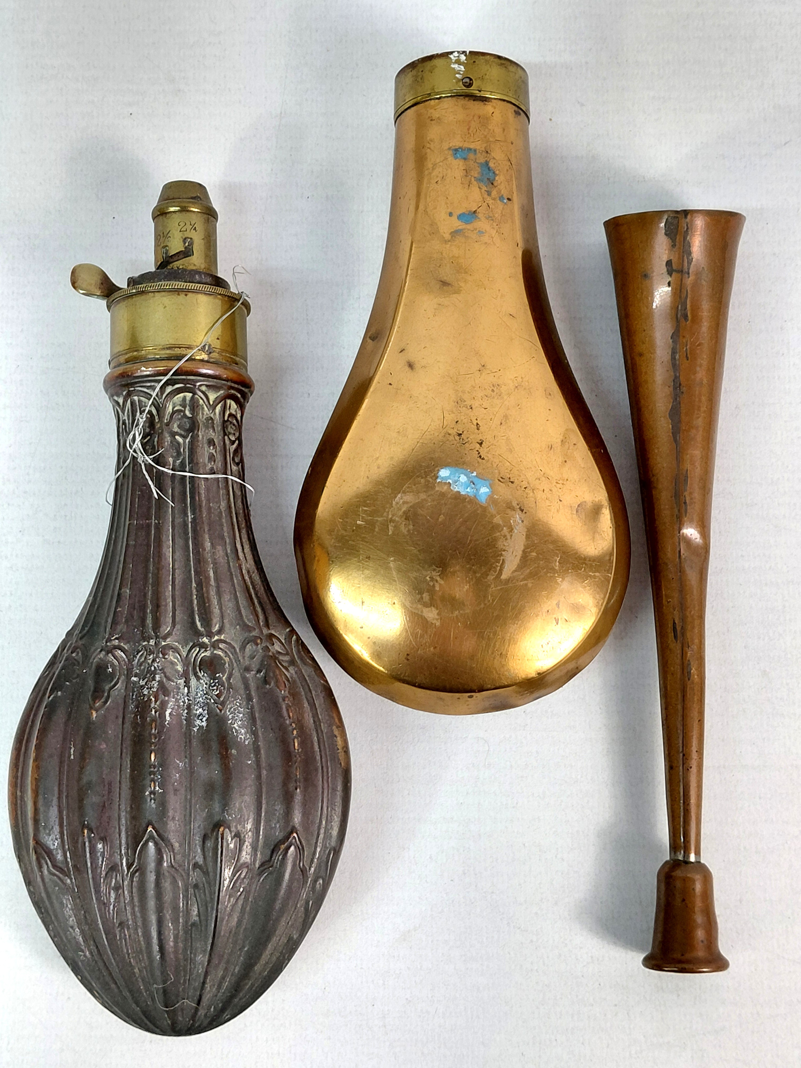 Three 19th century items: two copper powder flasks (longest 8 inches ...