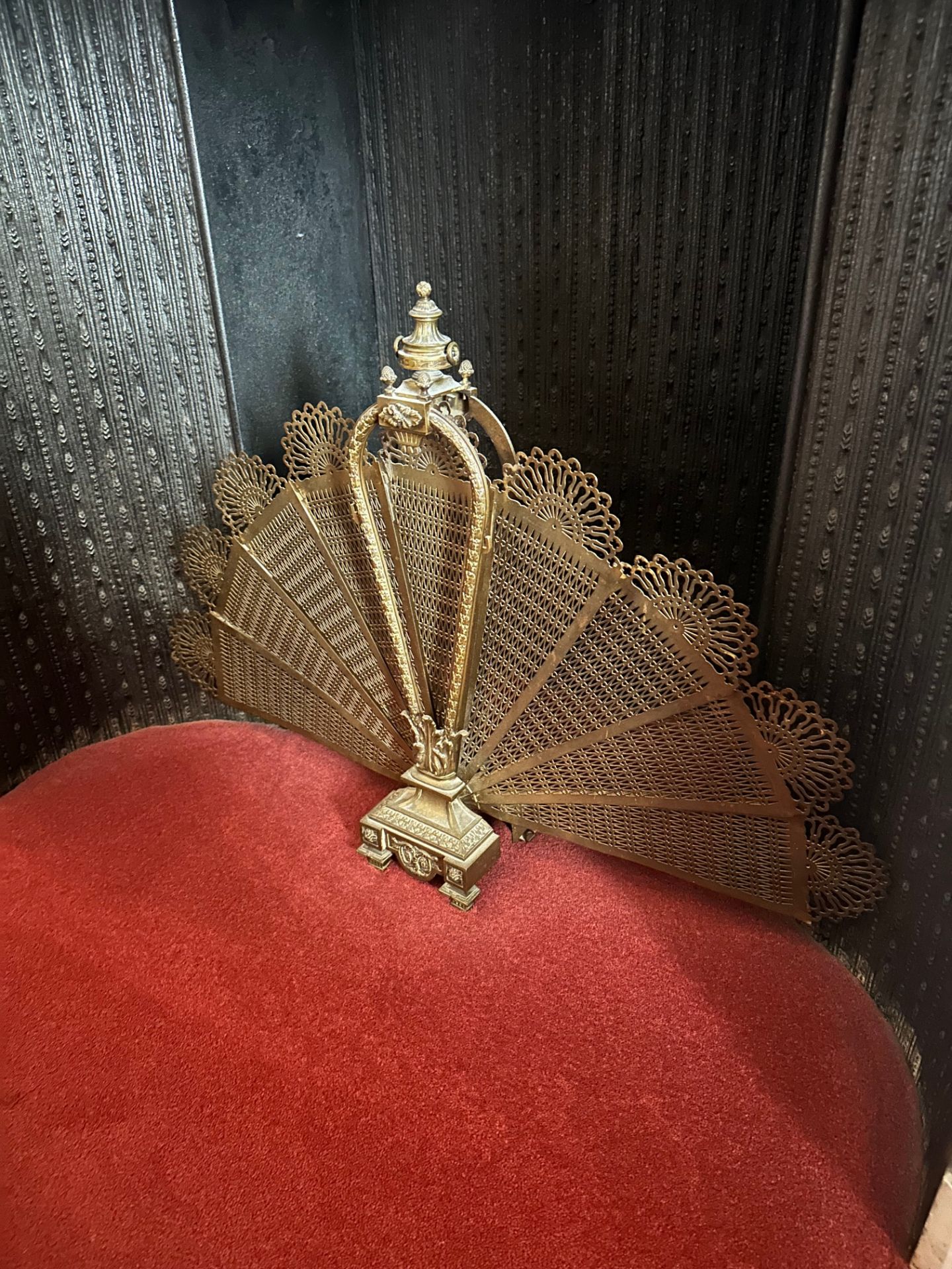 An Edwardian style English brass folding ‘peacock’ fire screen. The fan ...