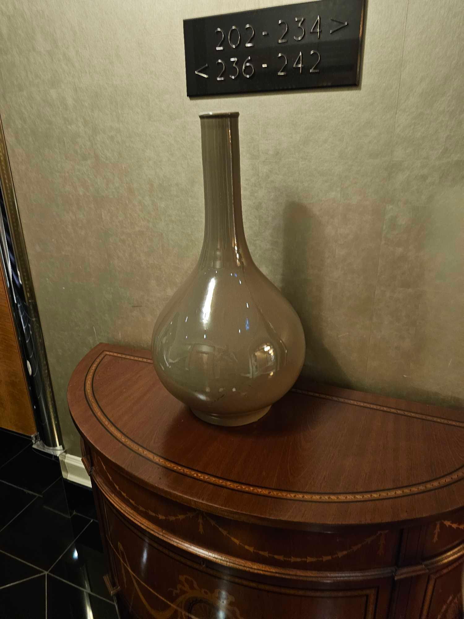 A tall, sculptural ceramic vase by Asiatides, Paris, featuring a ...