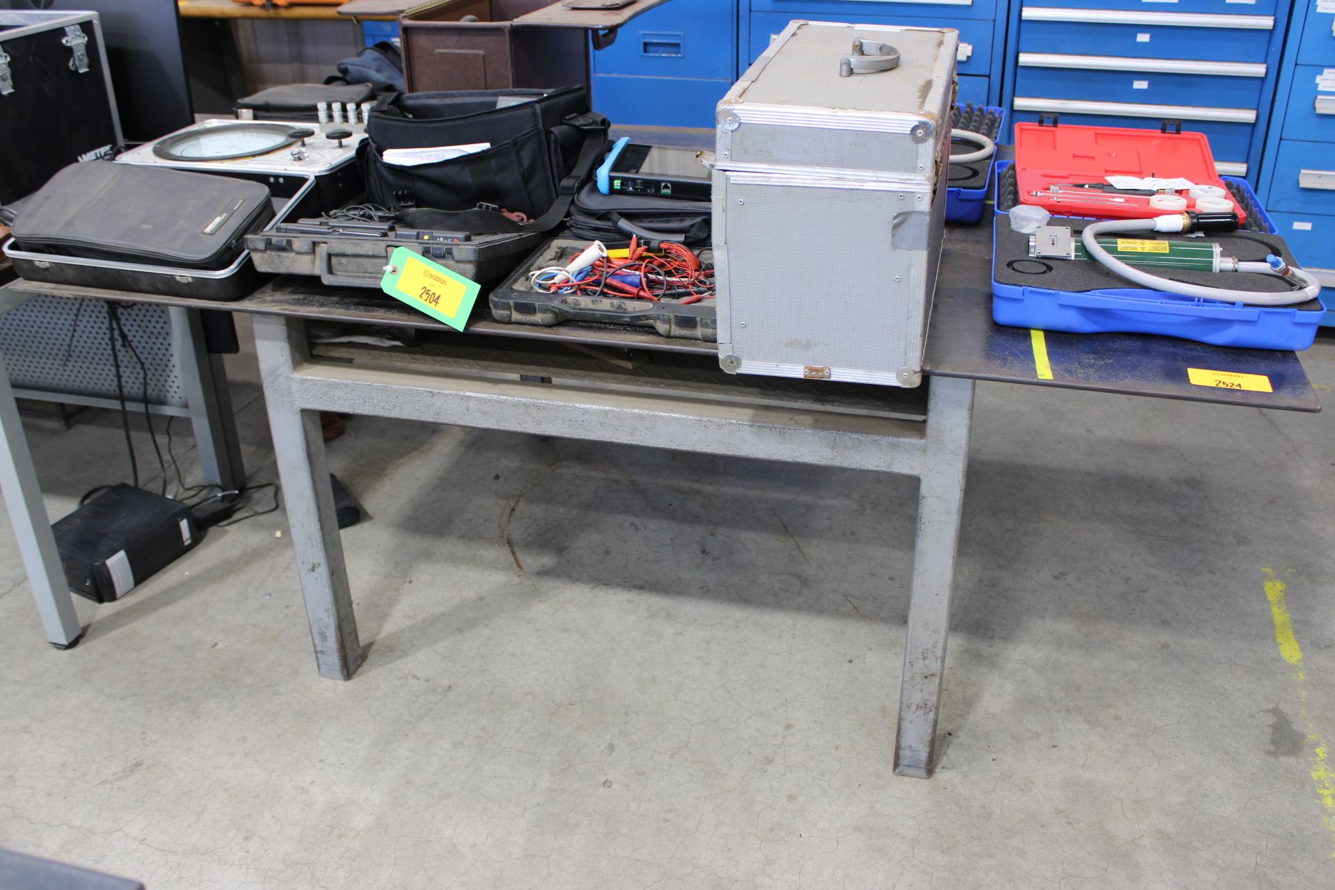[Lot of (2) steel shop tables measuring 120""l x 34""w and 78""l x 48 ...