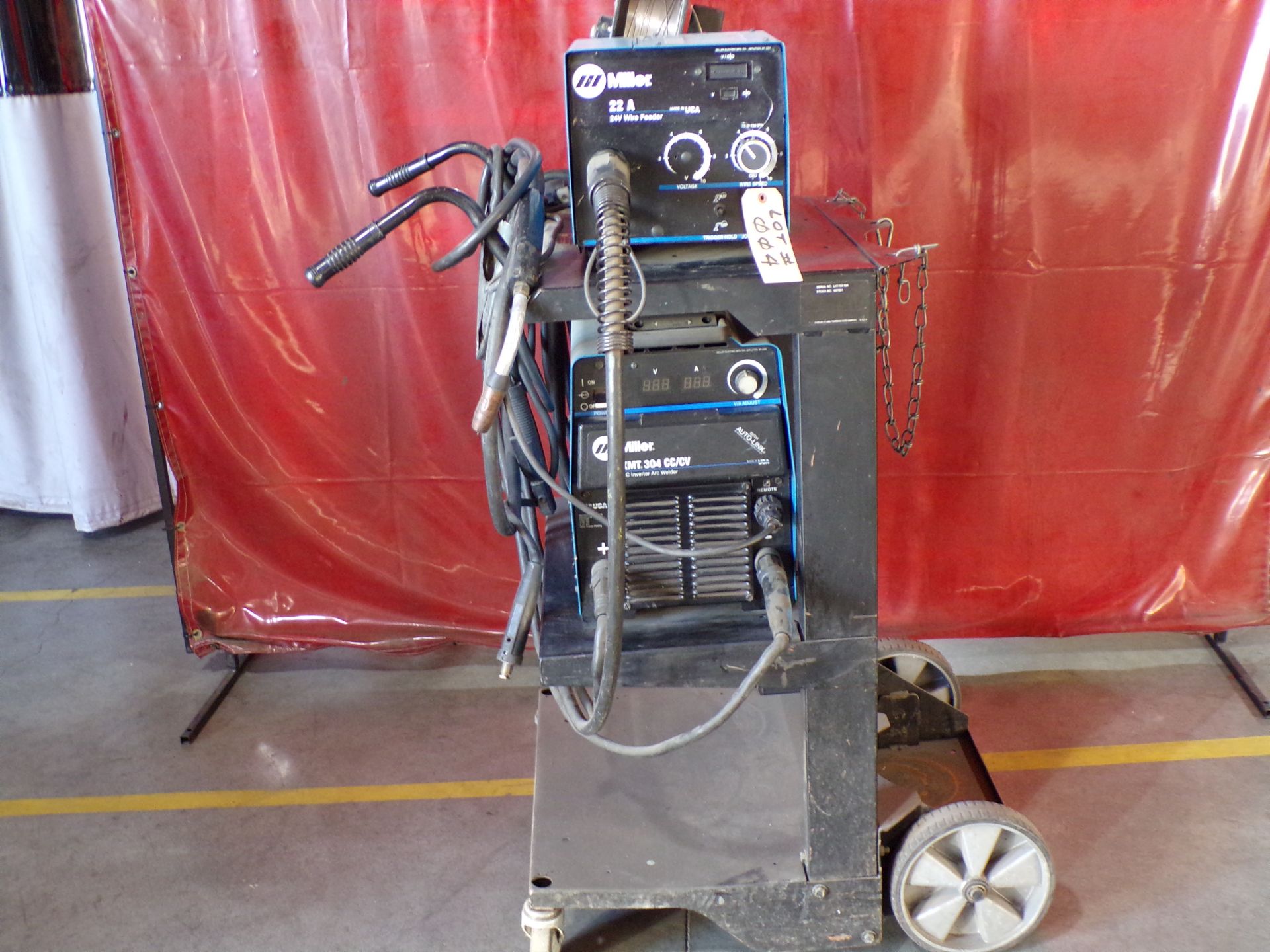 Miller Welder, model XMT304 CC-CV w/ Wire Feeder, s/n LH080440W + Cart