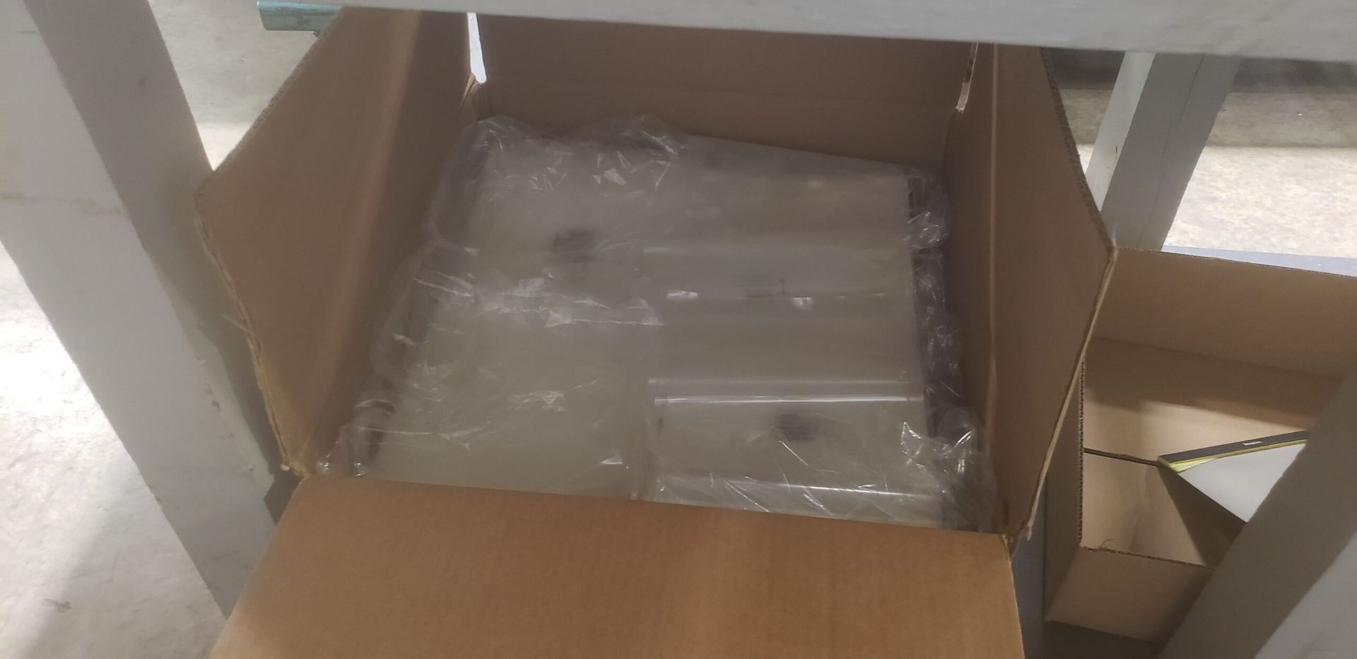 (2) Wood Tables with Contents, Tape Dispenser, Shrink Wrap, Etc. - (2 ...