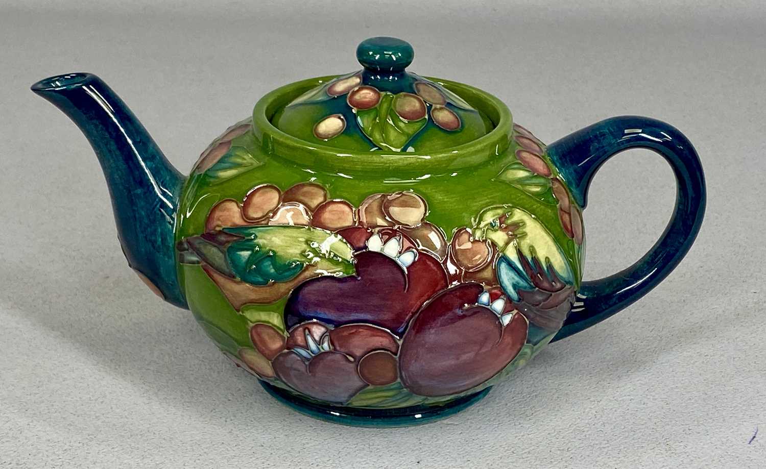 MOORCROFT FINCH & BERRIES TEA SET, on green ground, comprising circular ...