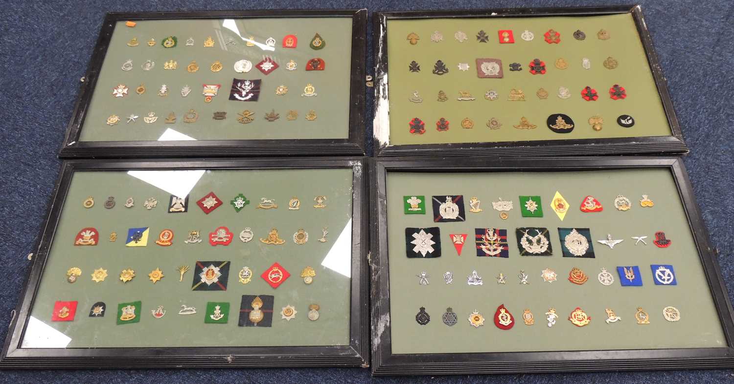 COLLECTION OF MILITARY CAP & OTHER BADGES, mounted and framed ...