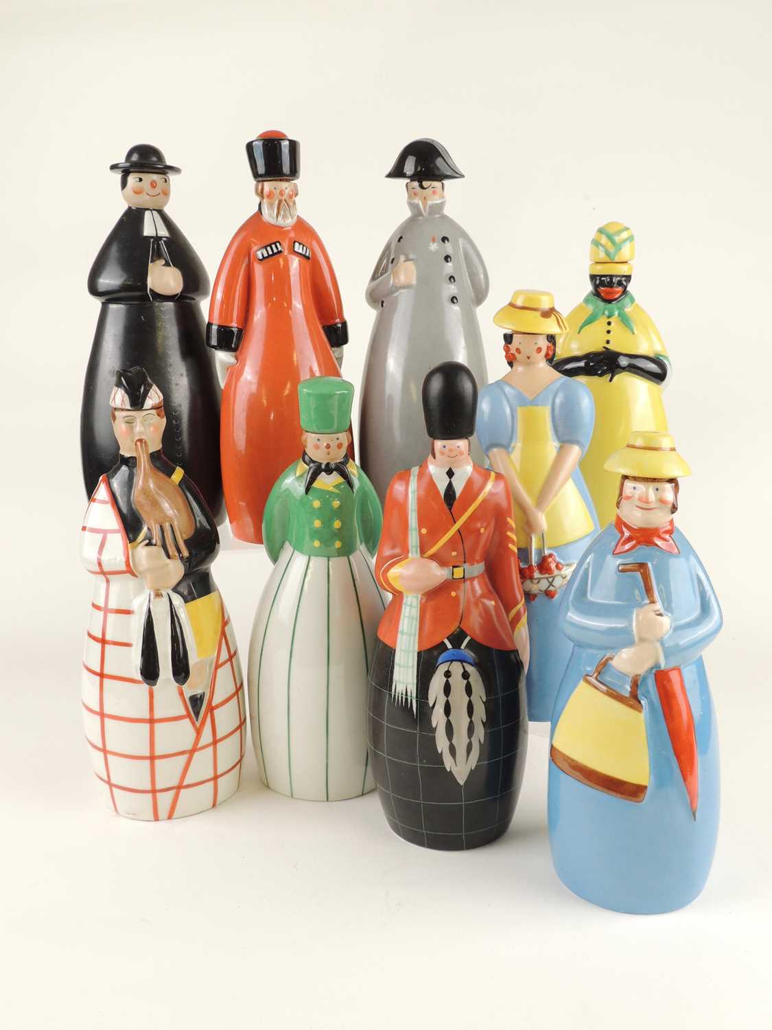 ROBJ PORCELAIN, PARIS: NINE LIQUEUR DECANTERS, modelled as characters ...