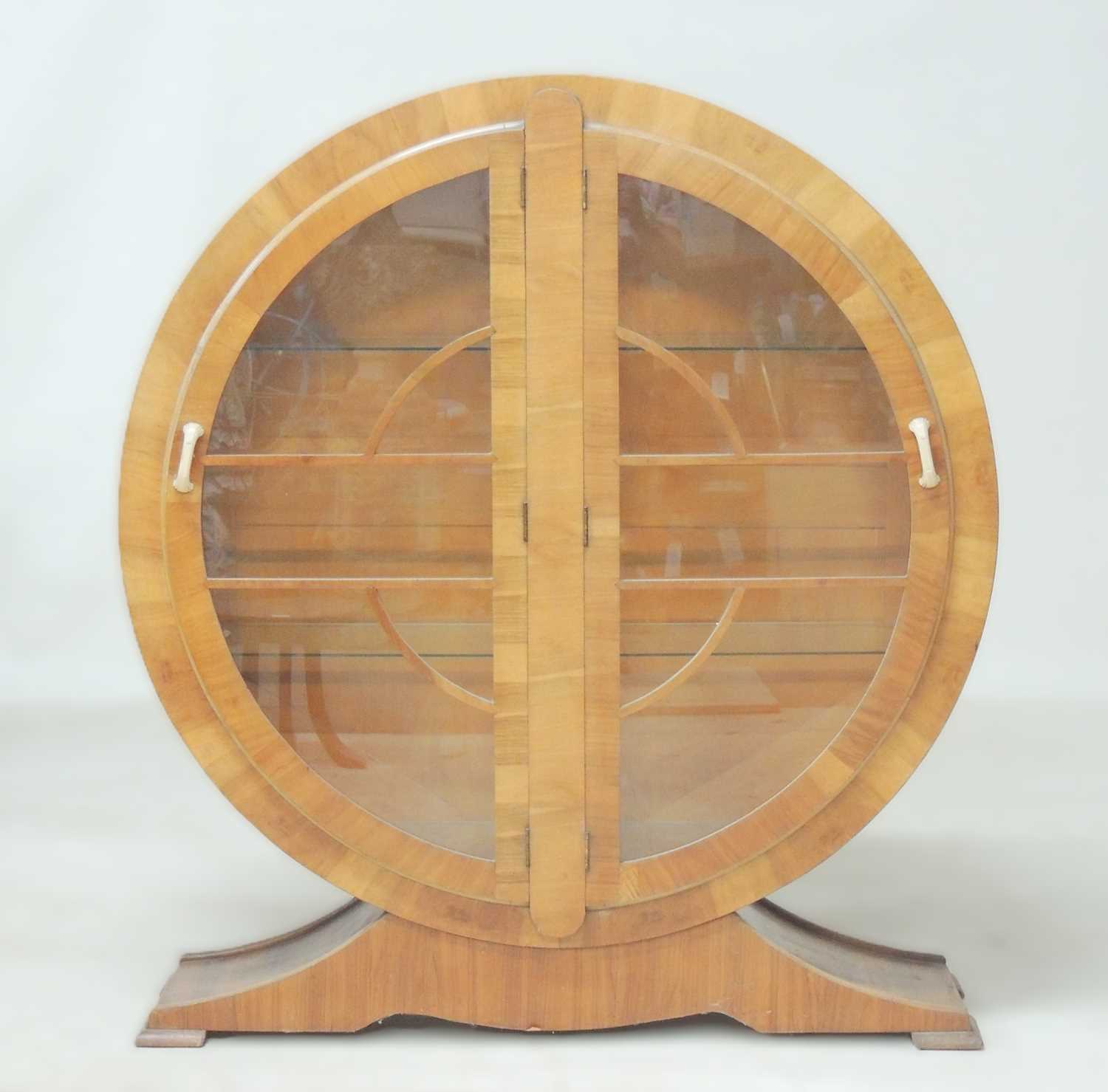 ART DECO WALNUT CIRCULAR DISPLAY CABINET, c. 1935, two doors with ...