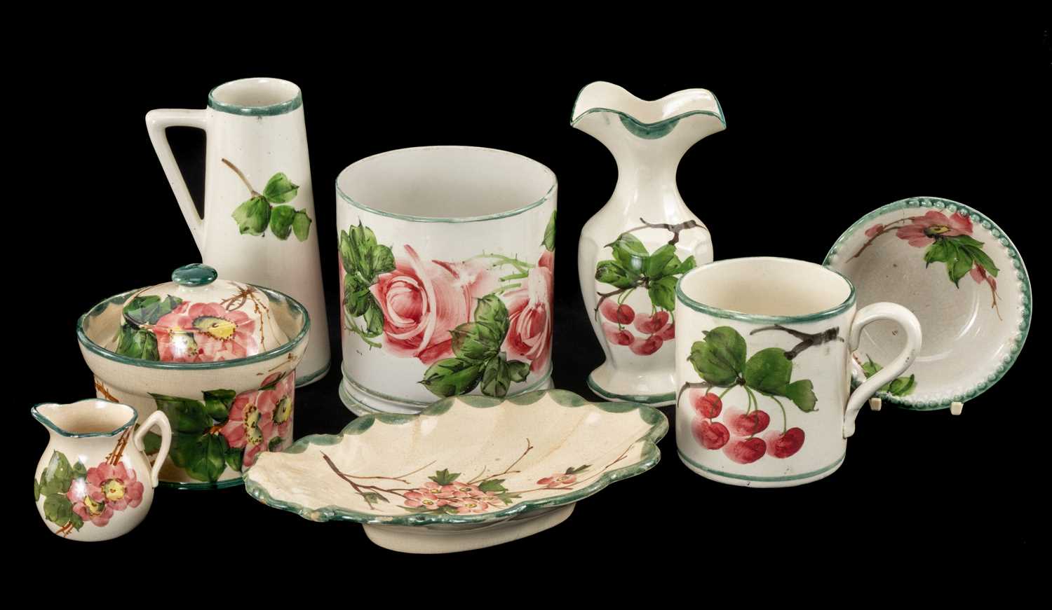 LLANELLY POTTERY GROUP OF EIGHT PIECES, decorated in roses and cherries ...