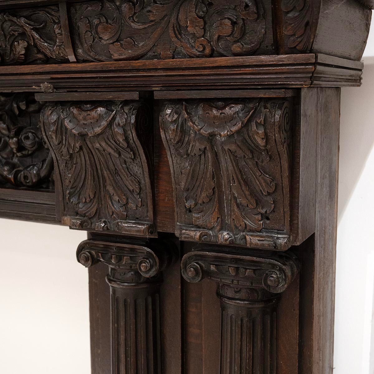 19th century Jacobean Revival oak fire place surround, decorated with ...