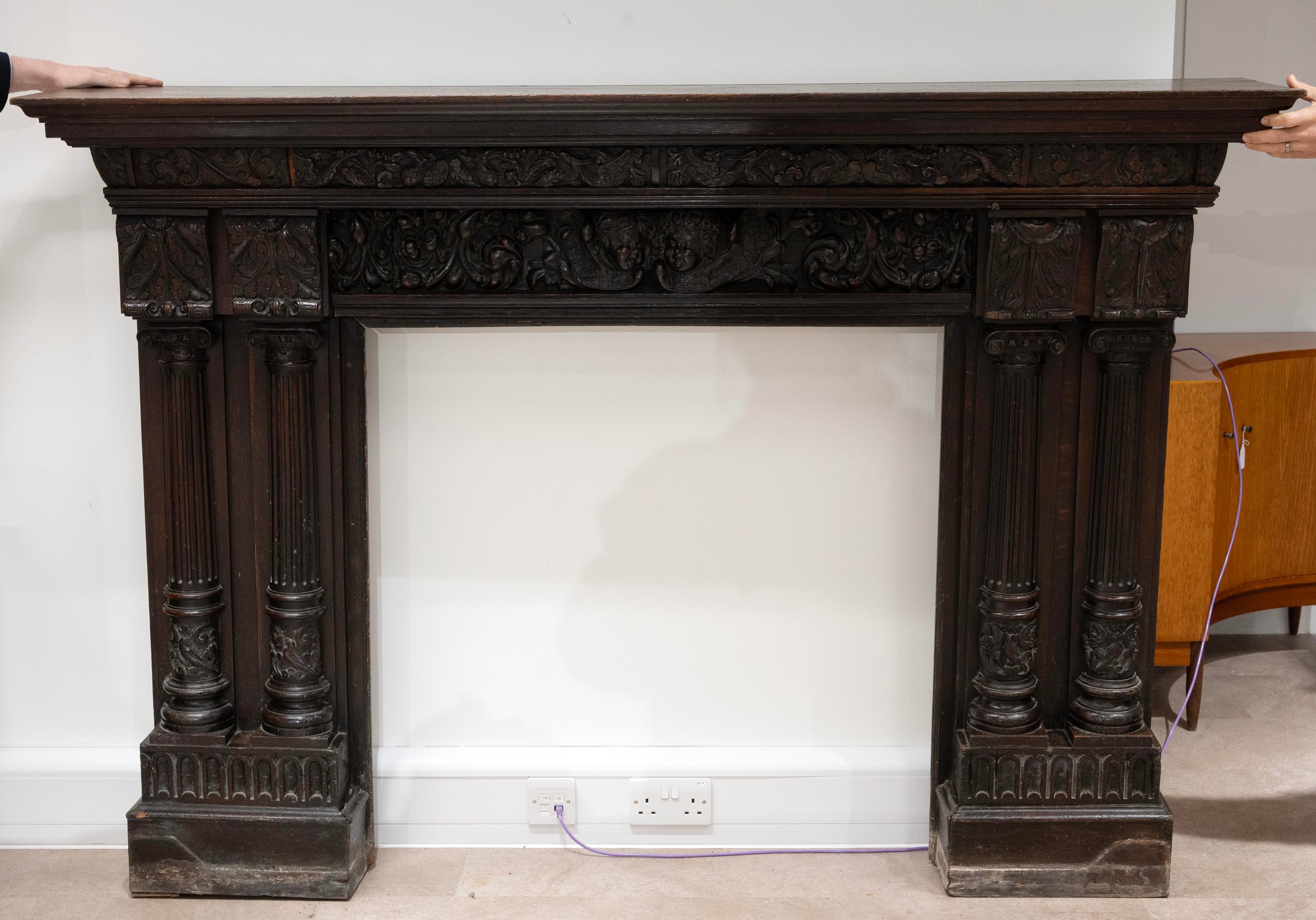 19th century Jacobean Revival oak fire place surround, decorated with ...