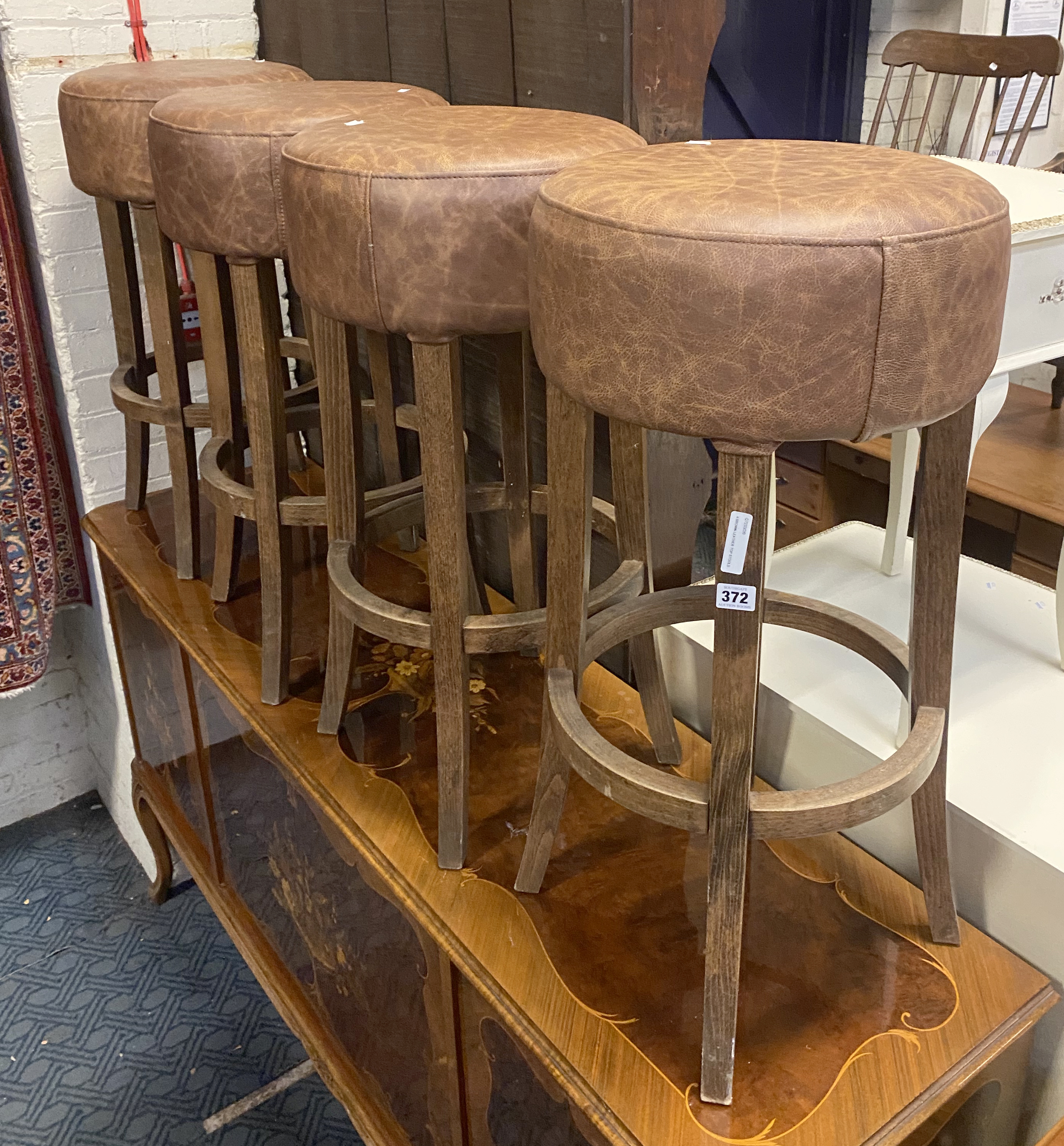 4 BROWN LEATHER TOP STOOLS