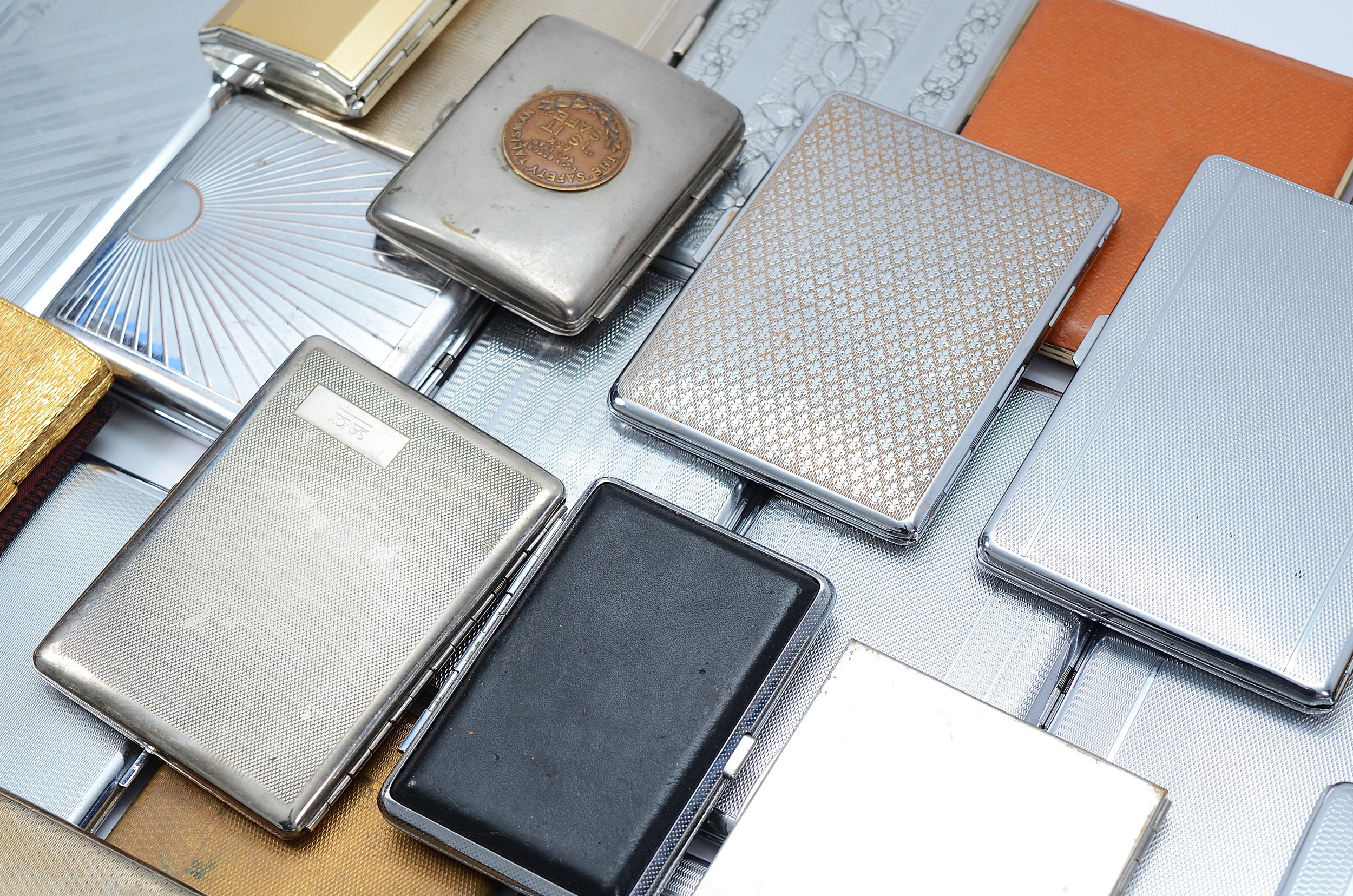 A collection of mid 20th century cigarette cases, including plated and ...