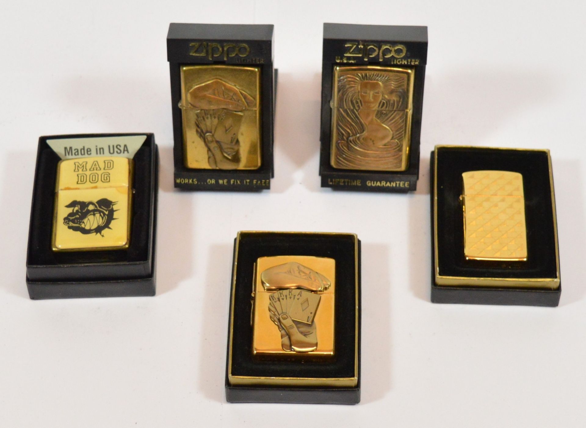 Zippo U.S.A ; Five Zippo pocket cigarette lighters, brushed steel and ...