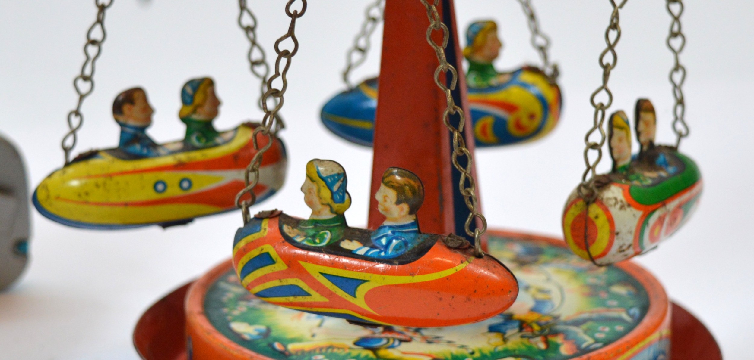Alps Of Japan; A 1950s lithographed tinplate 'Merry Go Round' wind-up ...