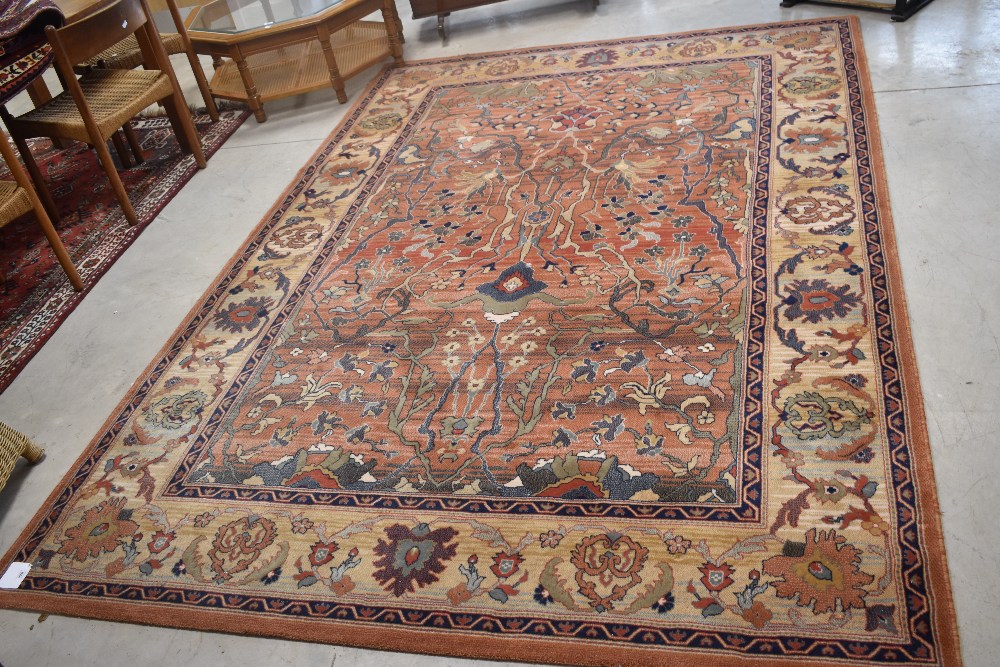 A modern Belgian carpet , having russet ground and naturalistic design ...