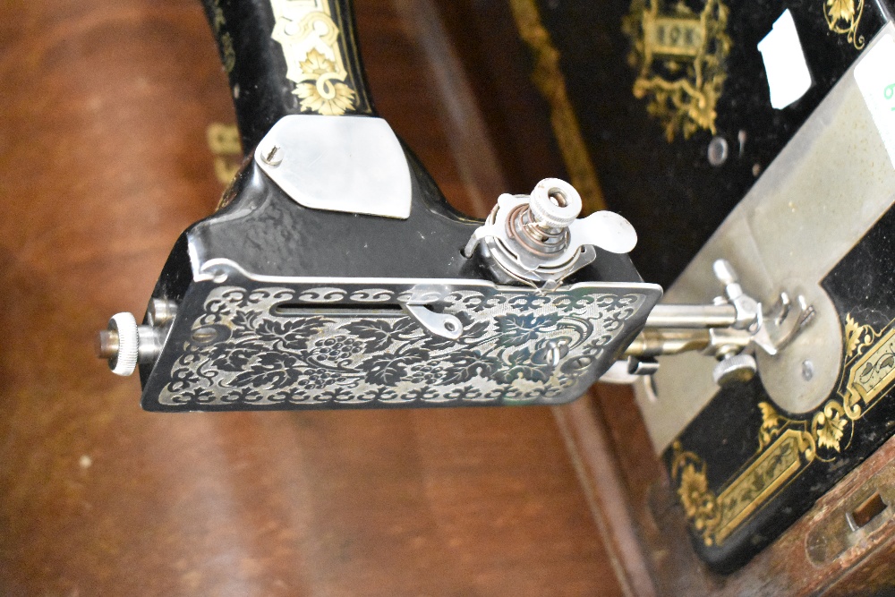 A vintage Singer sewing machine, serial number A161388, complete with ...