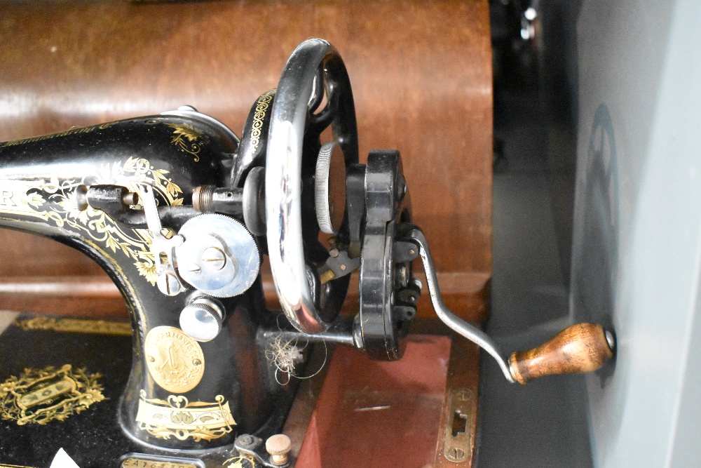 A vintage Singer sewing machine, serial number A161388, complete with ...
