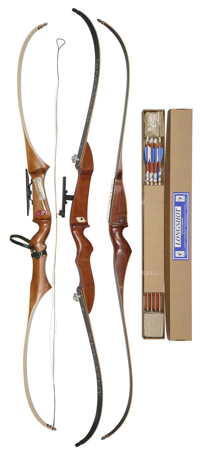 TWENTY MARKSMAN ARCHERY RECURVE BOWS AND FIVE BOXES OF ARROWS, 20TH ...