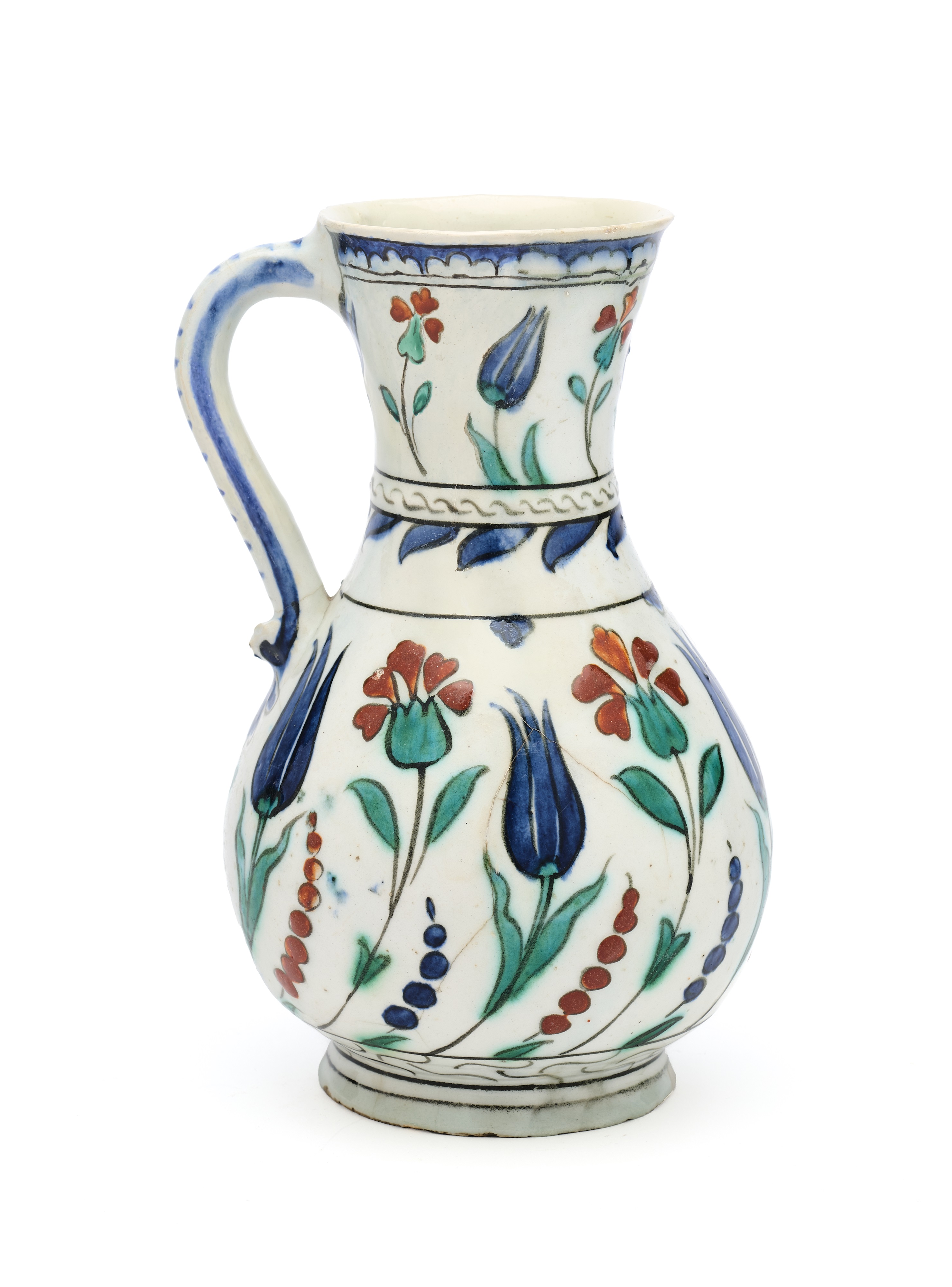 AN IZNIK POTTERY JUG, OTTOMAN ANATOLIA, CIRCA 1600 underglaze painted ...