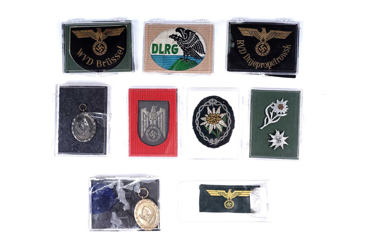 A selection of German Second World War cloth badges, including: Railway ...