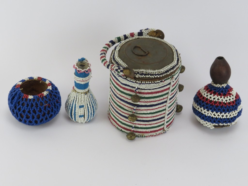 Three vintage South African glass beadwork decorated vessels and a ...