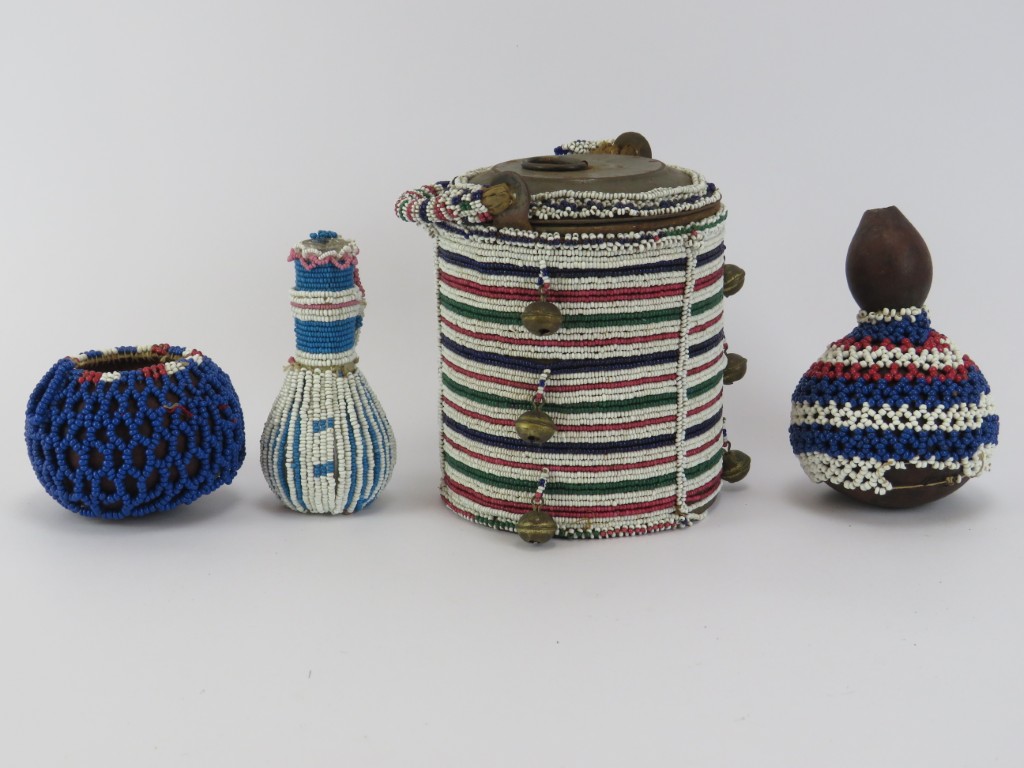 Three vintage South African glass beadwork decorated vessels and a ...