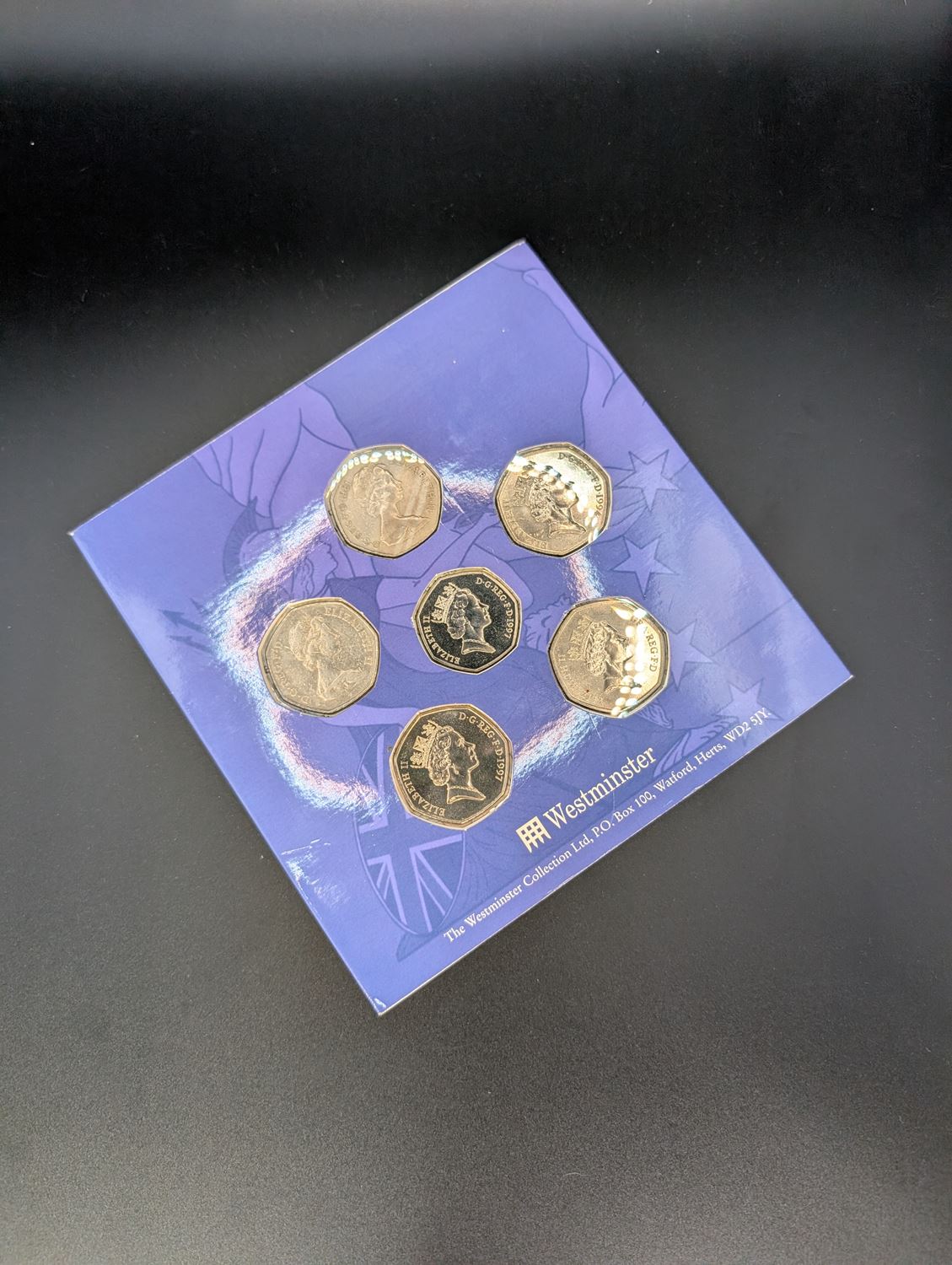 A UK 50p coin set to include 1992 E C rare 50p