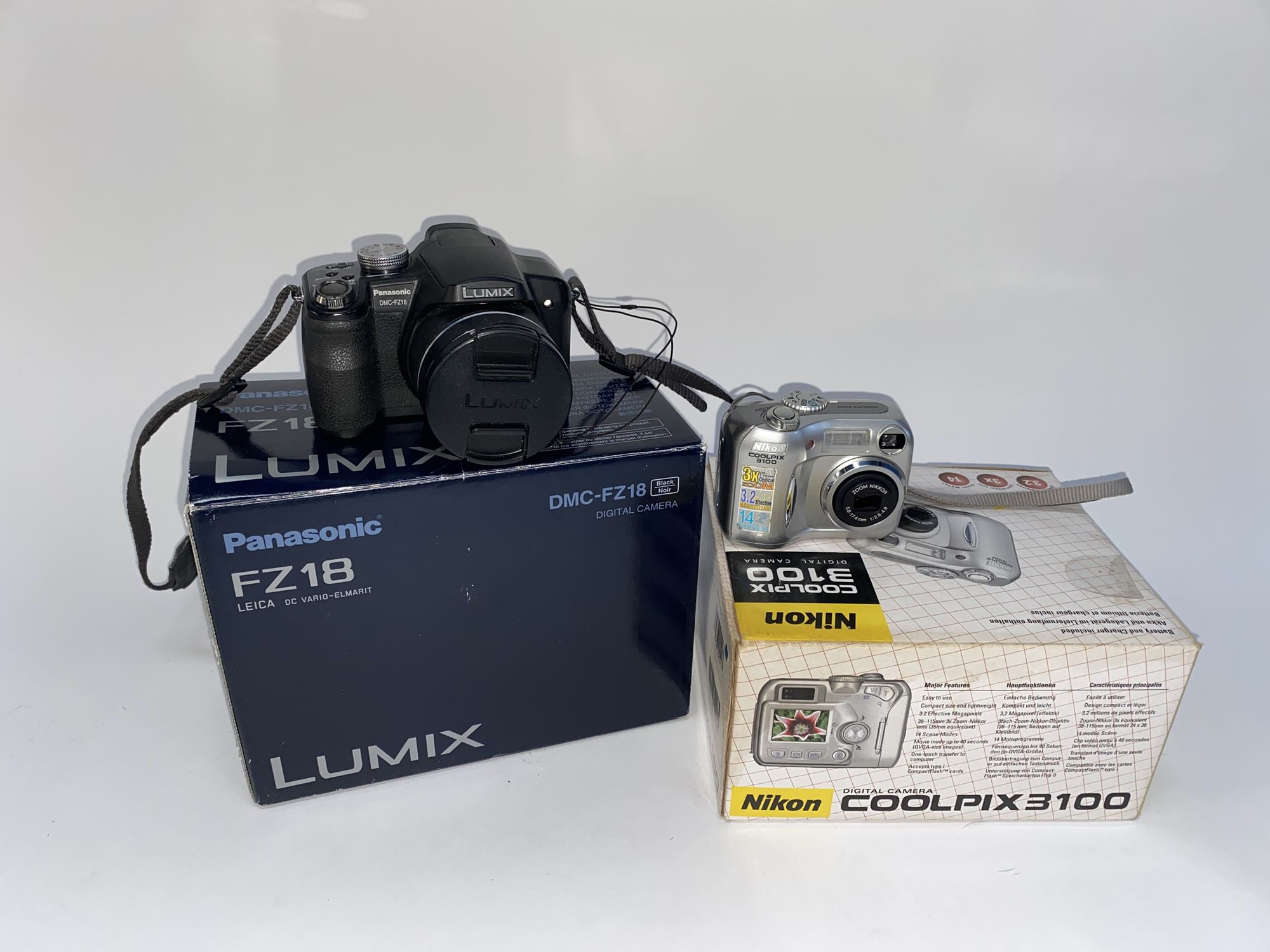 A Panasonic FZ18 Lumix camera and a Nikon Coolpix 3100