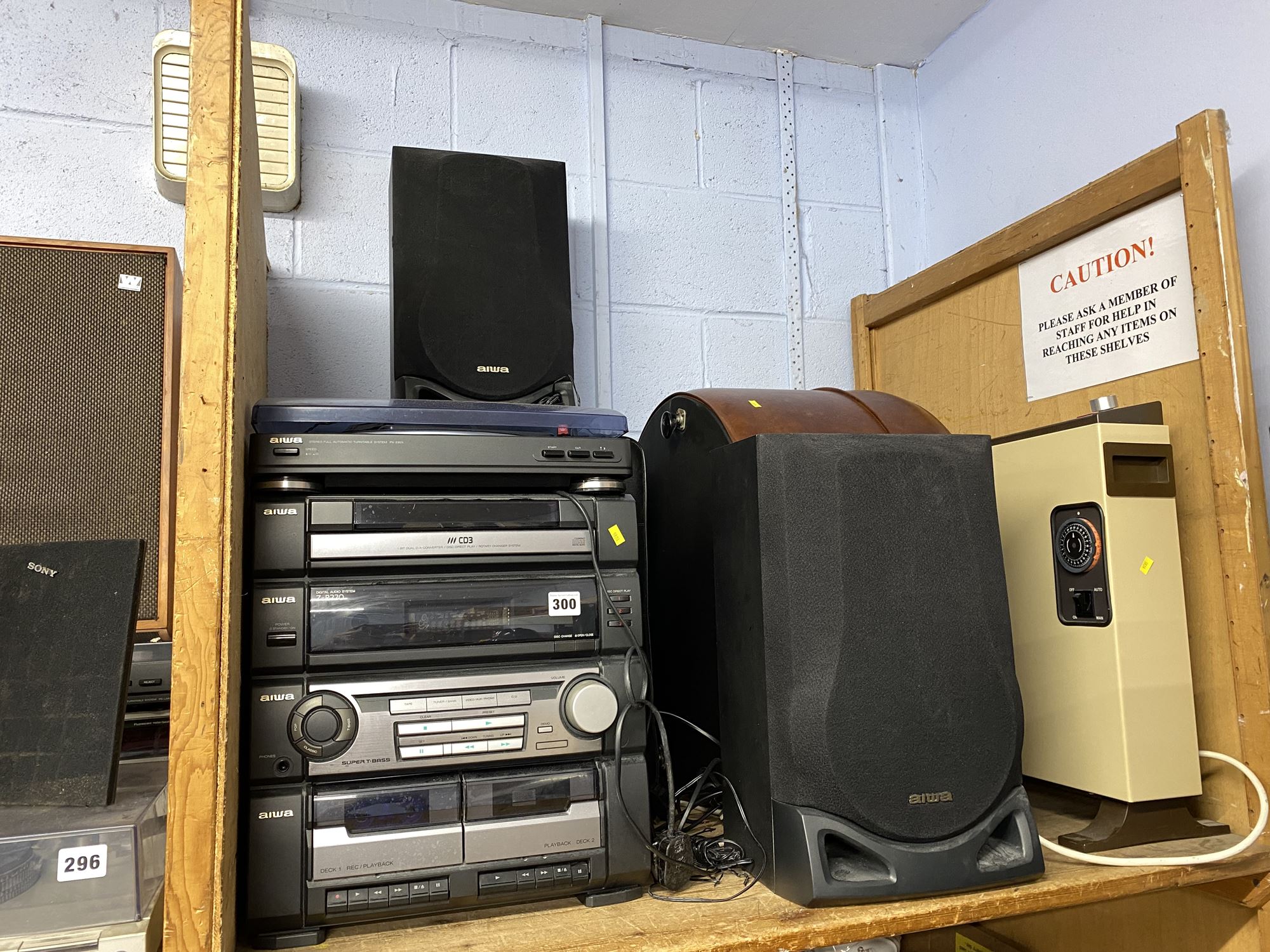 An Aiwa stacking sound system with speakers and an electric heater