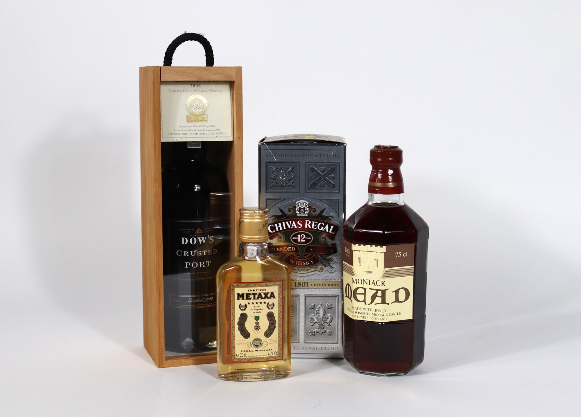 A boxed bottle of Dow's Crusted port, Moniack mead, Metaxa and Chivas ...