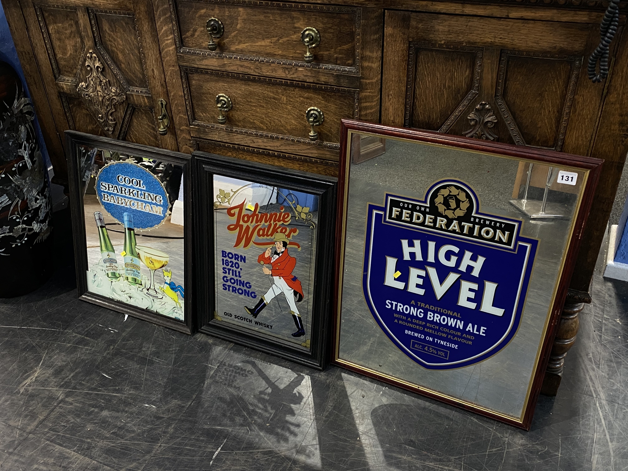 Three framed advertising mirrors including a High Level Strong Brown ...