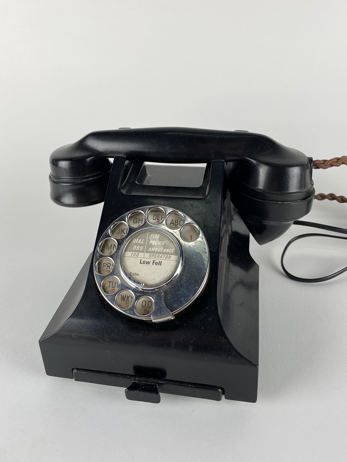 A vintage black bakelite telephone