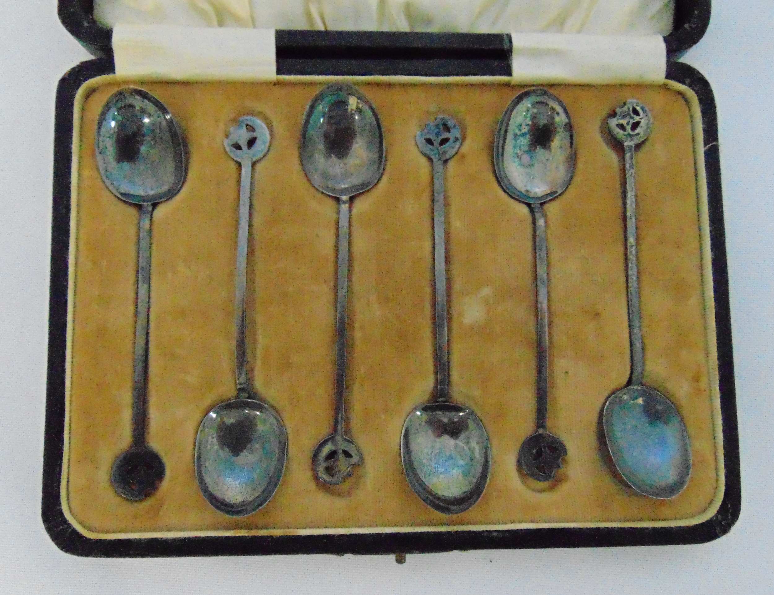 A cased set of hallmarked silver coffee spoons with moon and star ...