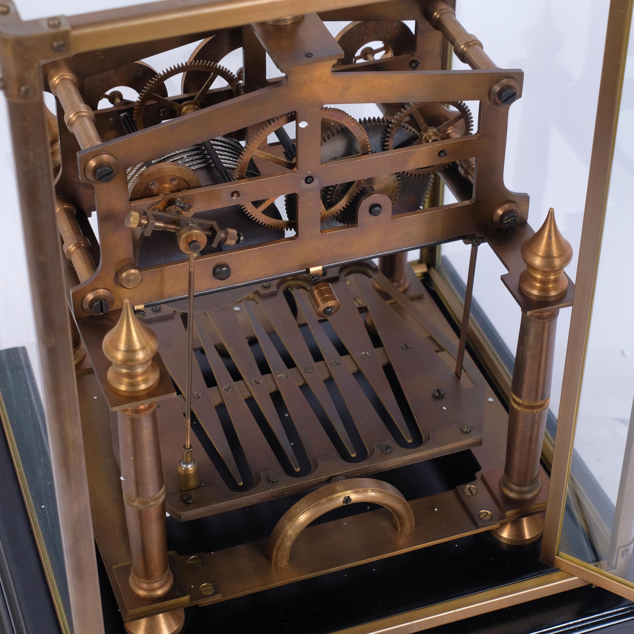 A reproduction brass-framed 5-glass panel Congreve (rolling ball ...